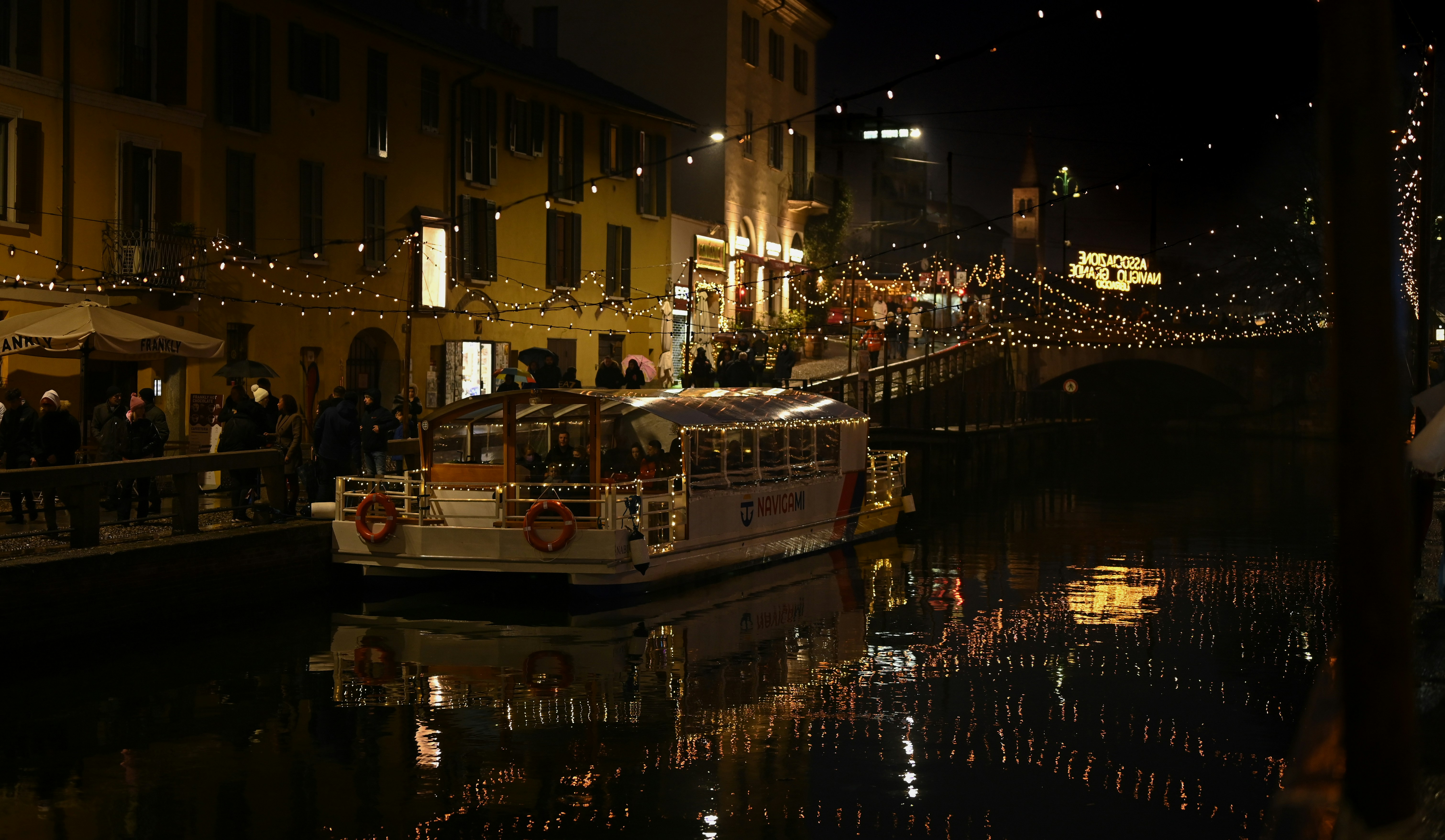 Night Canal Serenade: A Lantern-lit Boat Drifts Through a Town of Reflections