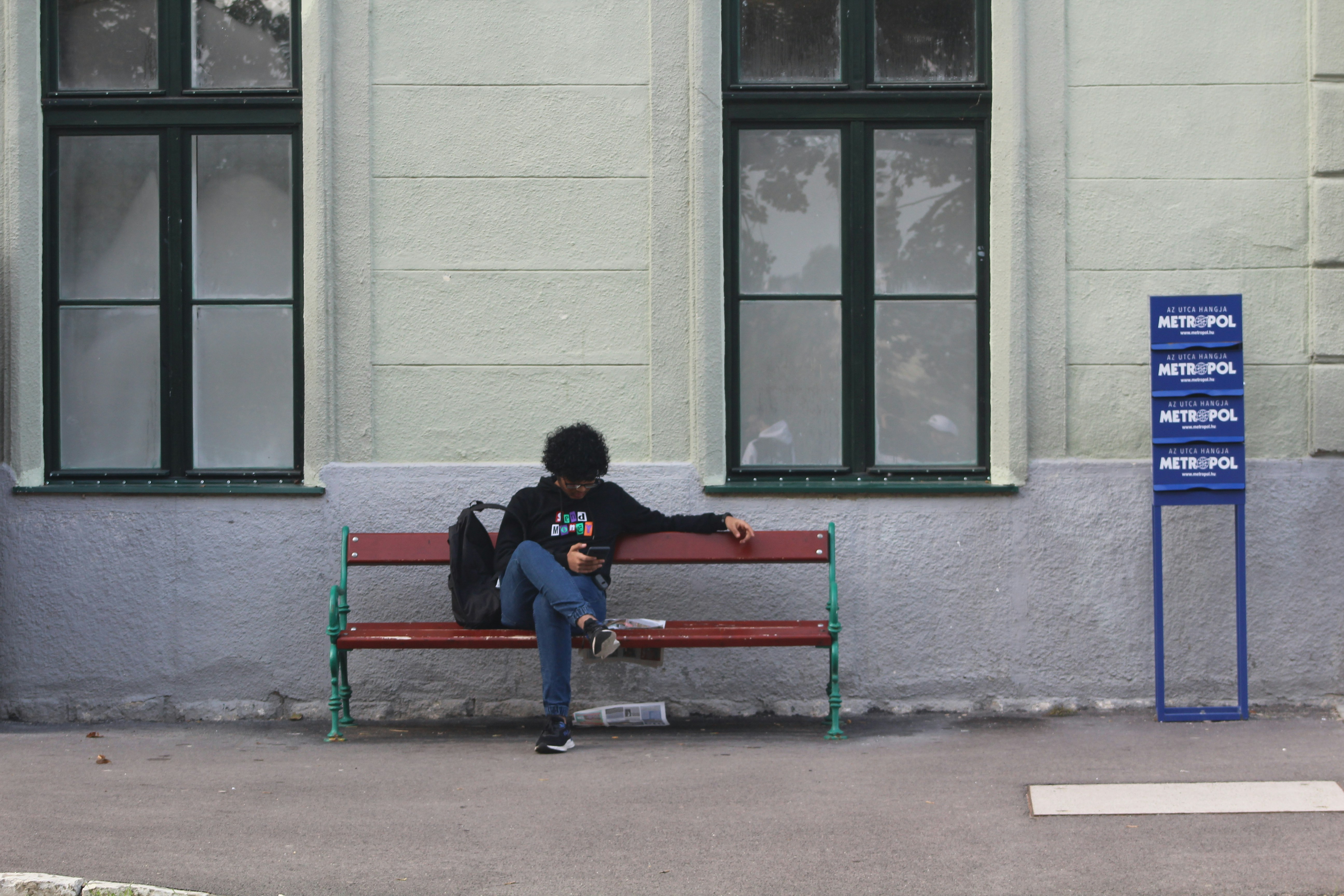 Boy sitting outside railway station waiting for train.Umair Ali Asad