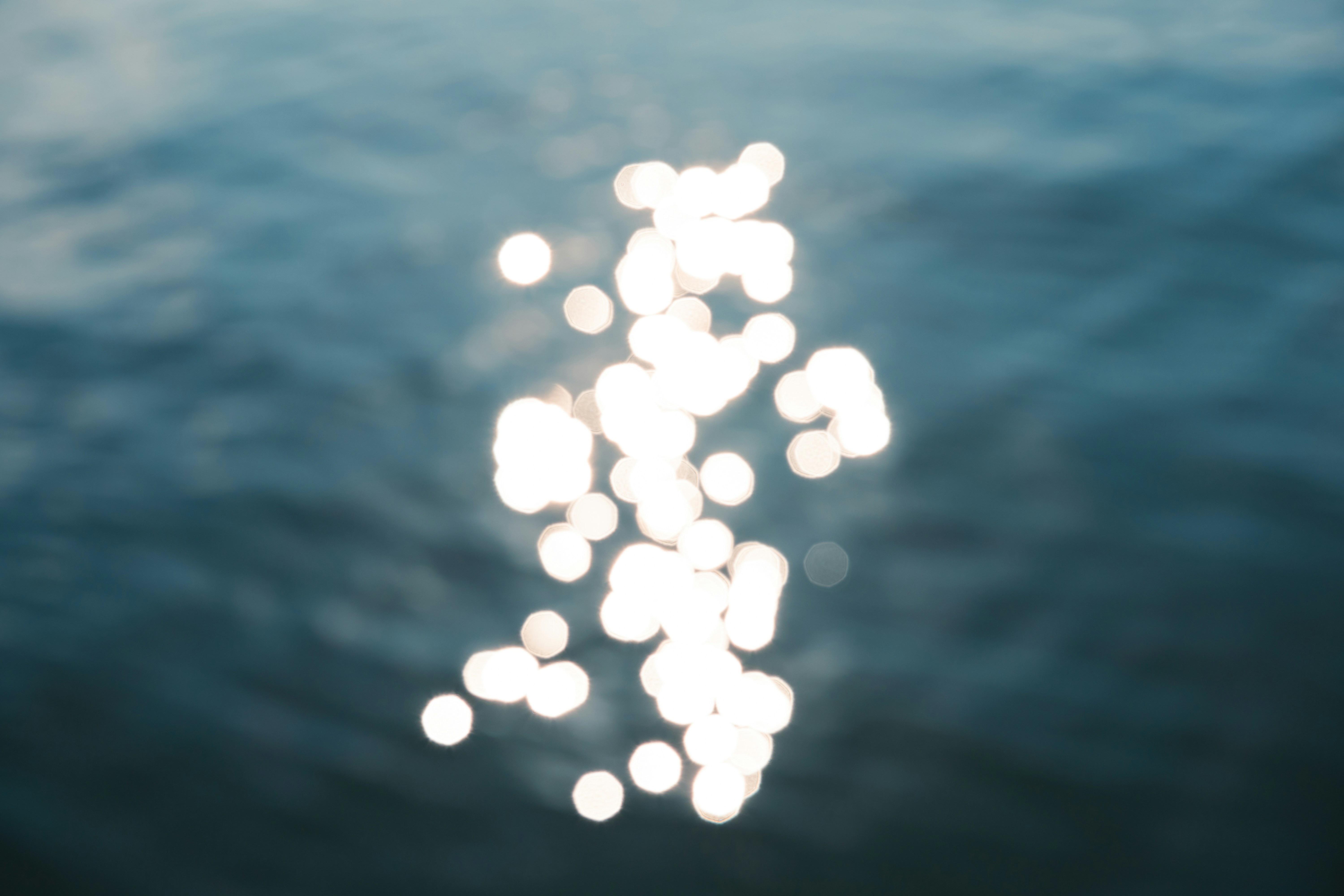 Vertical Sparkles on a Calm Blue Sea