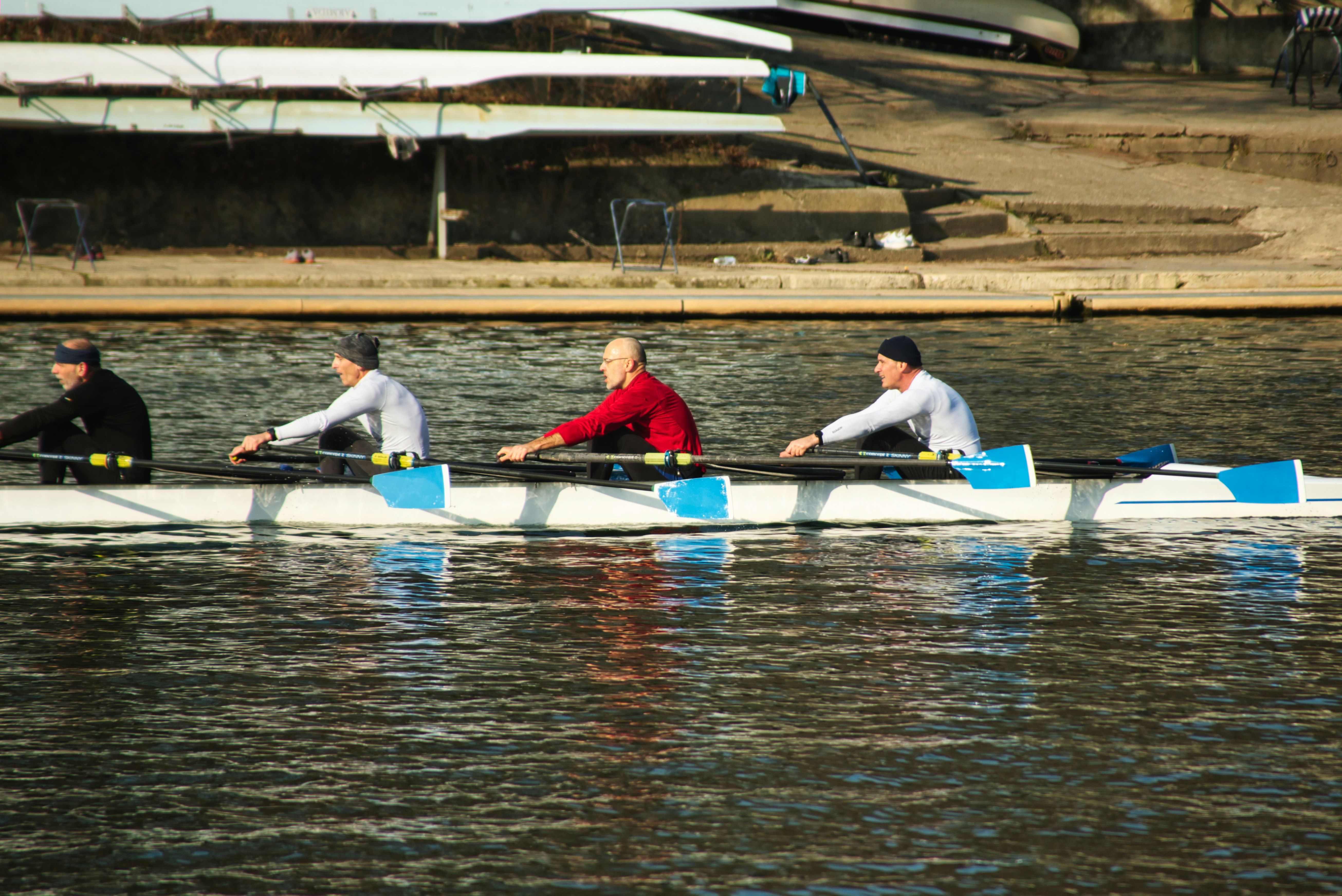 A group of people rowing a boat on a body of water photo – Free Turin ...