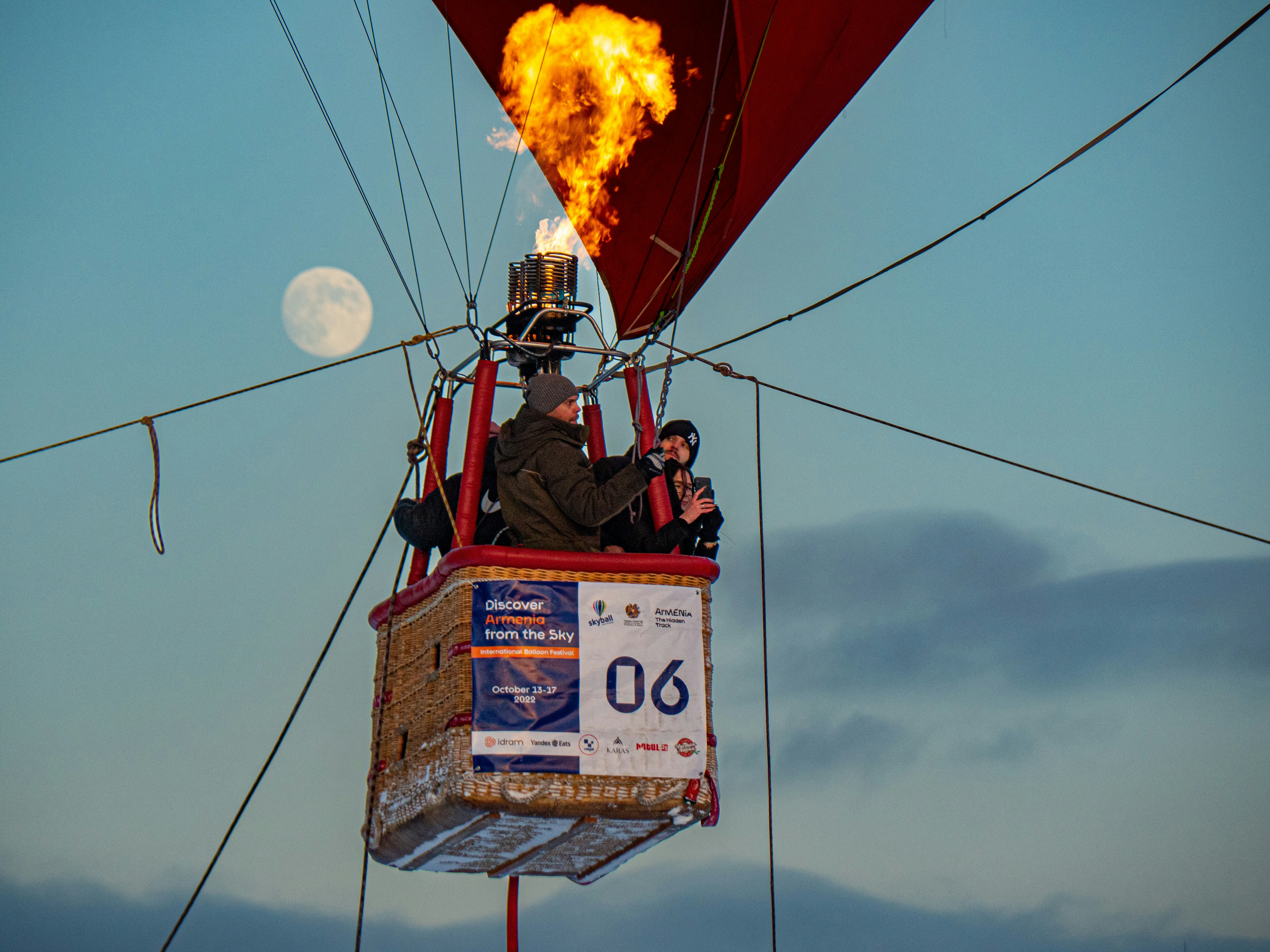 a hot air balloon being lifted by a crane