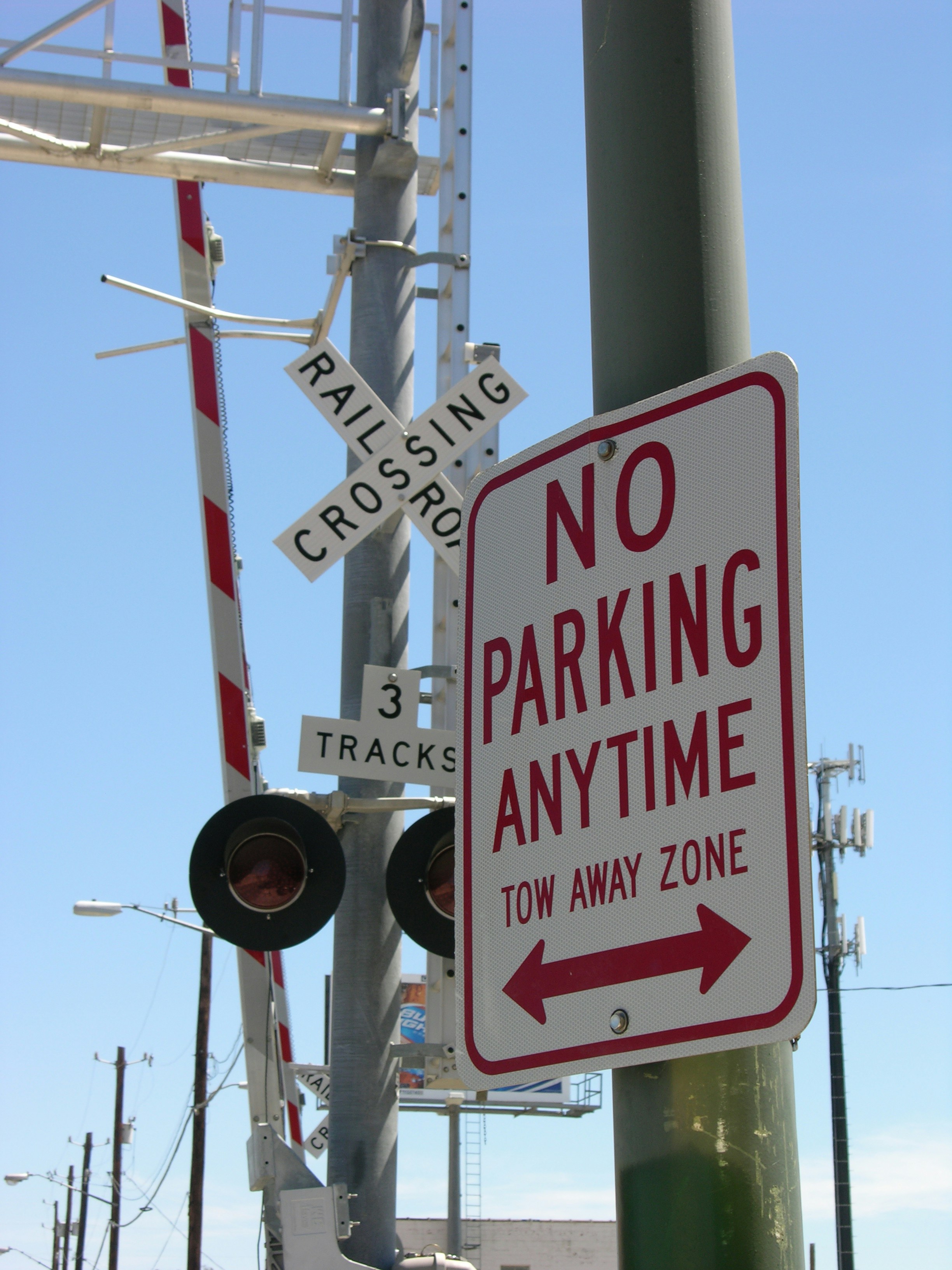 a no parking anytime sign on a pole