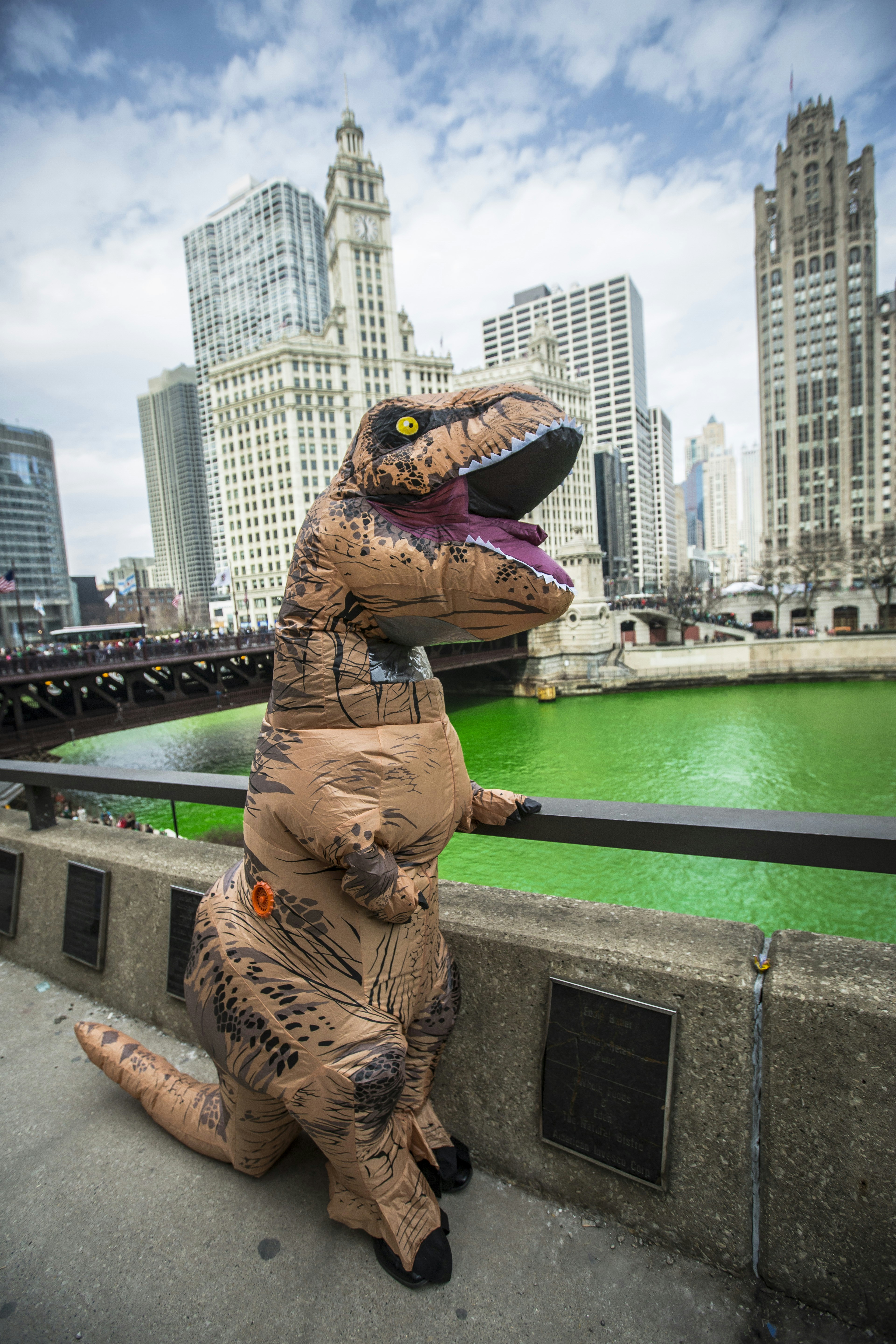 Emerald Riverfront Roar: Inflatable T-Rex Meets Chicago Skyline