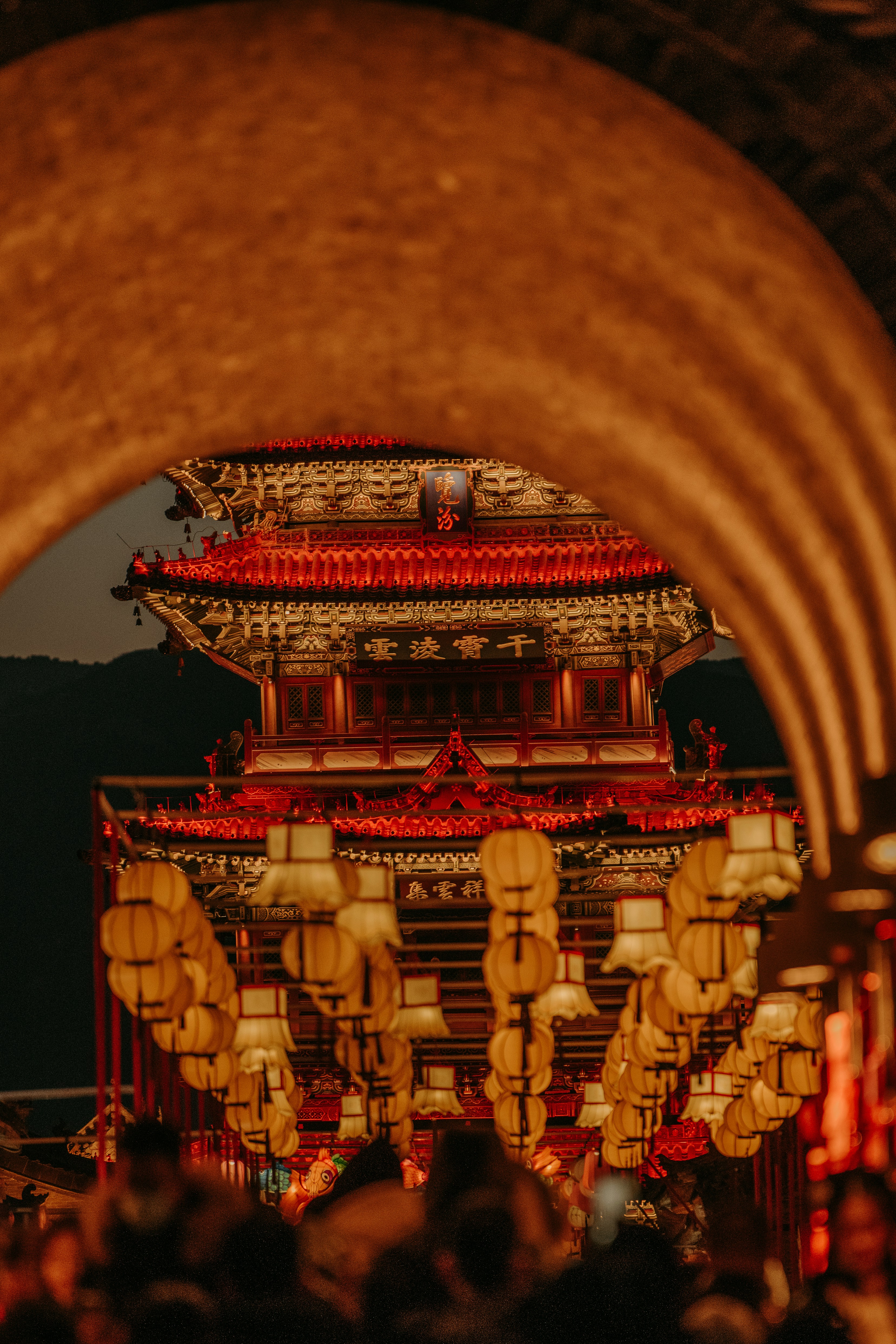 Lantern-lit Temple Through a Circular Frame