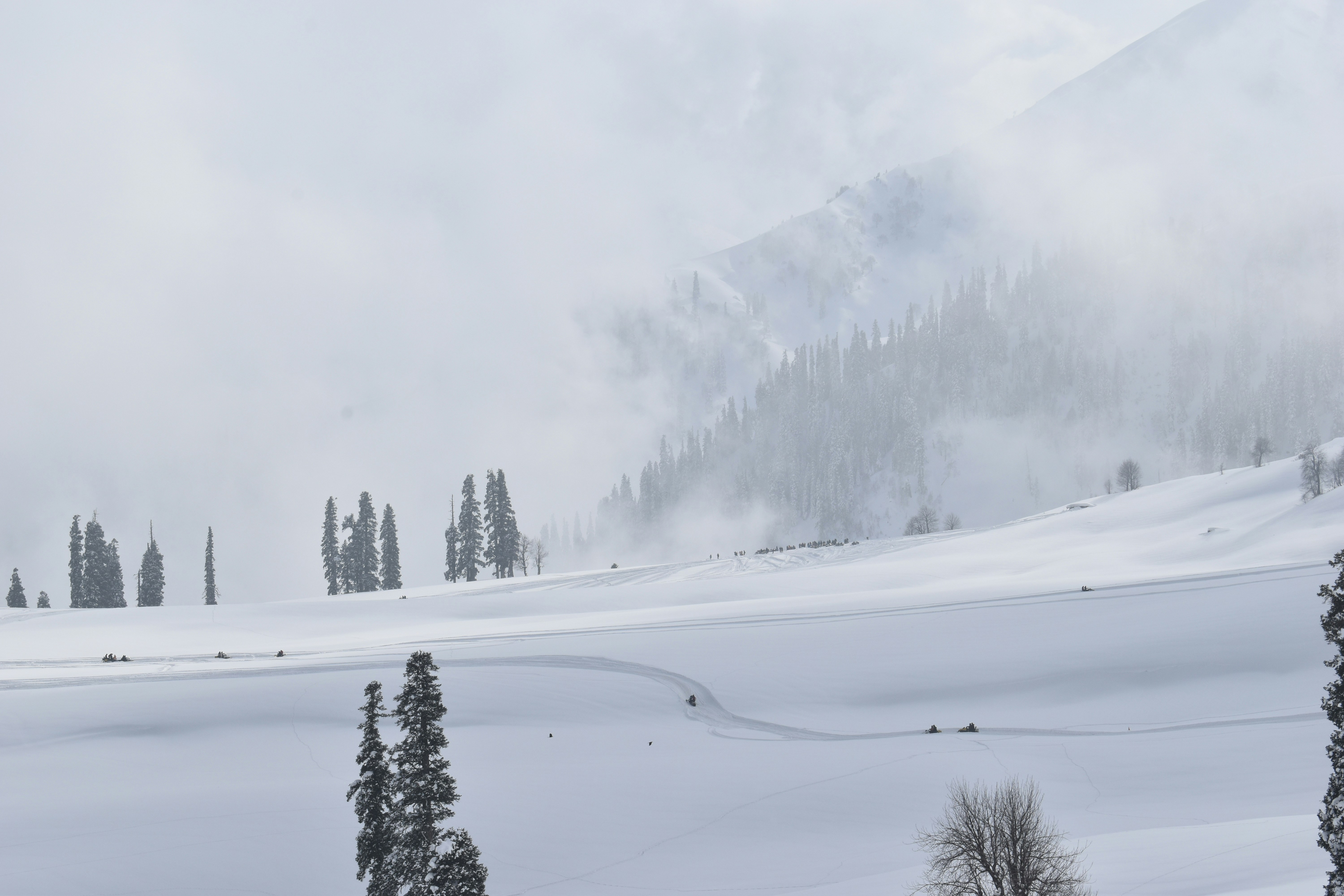 Veiled Ridge Over a Snow-Draped Basin