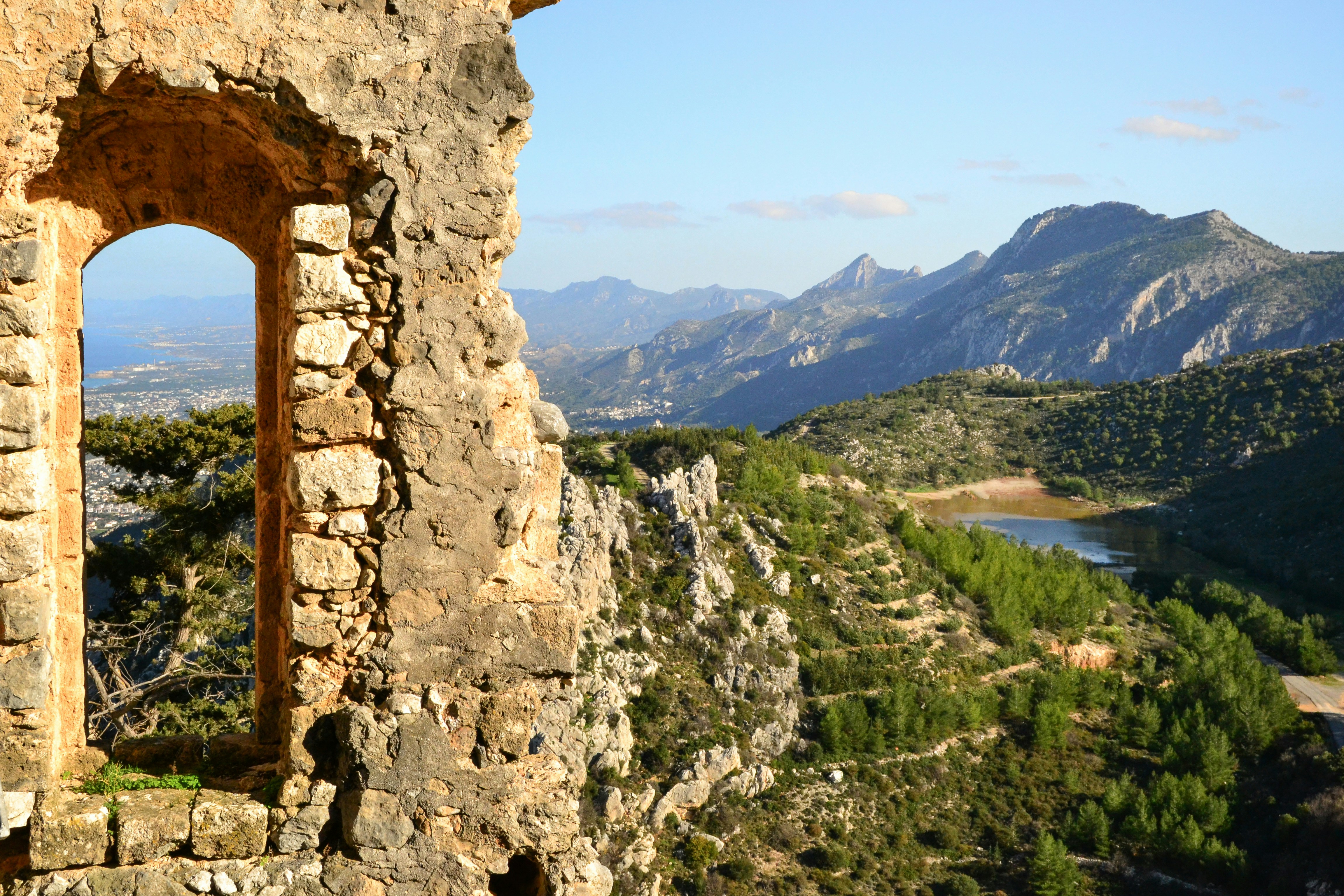 a window in the side of a stone building