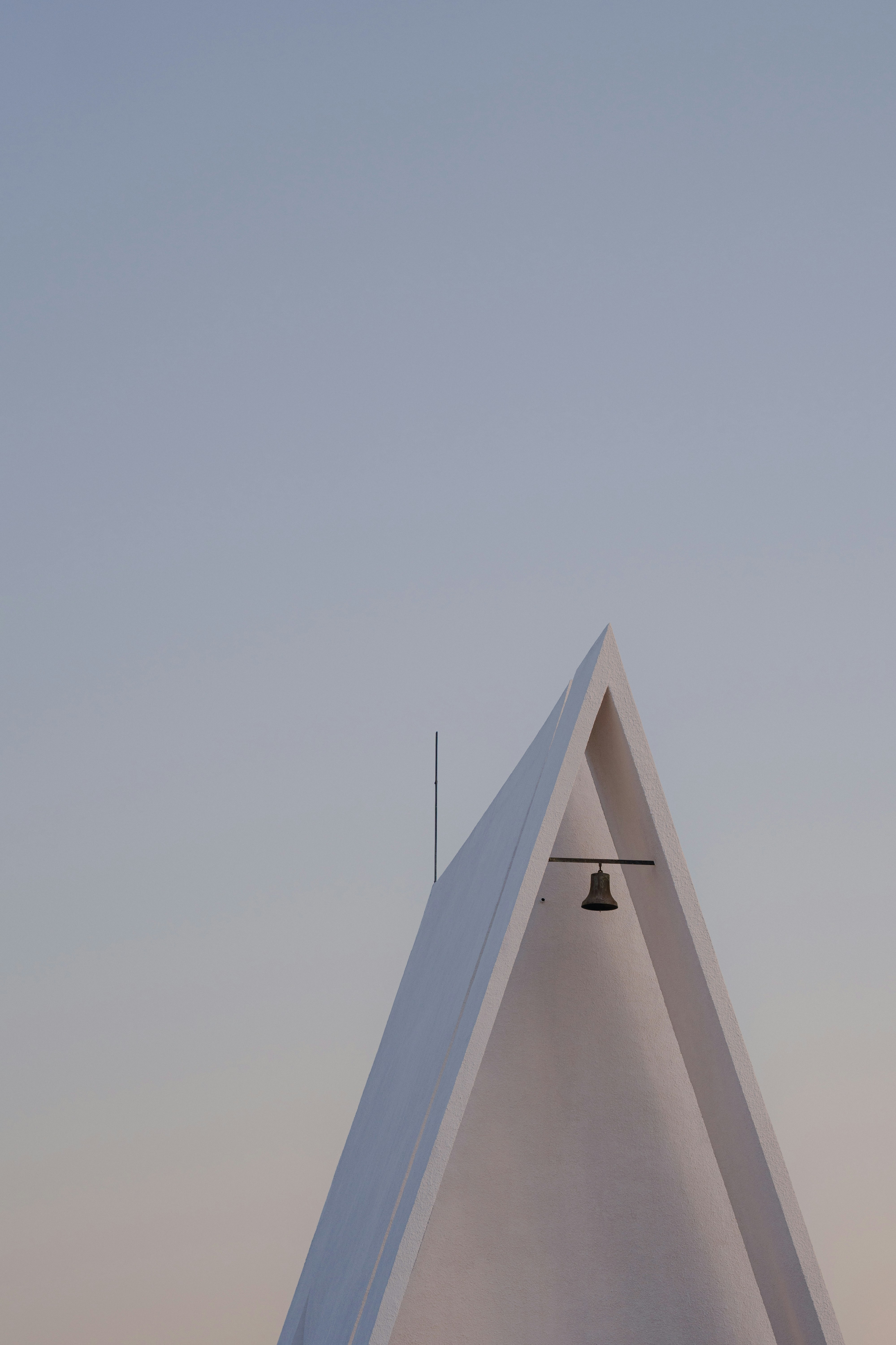 Pinnacle Bell: Geometry Meets Sky in White