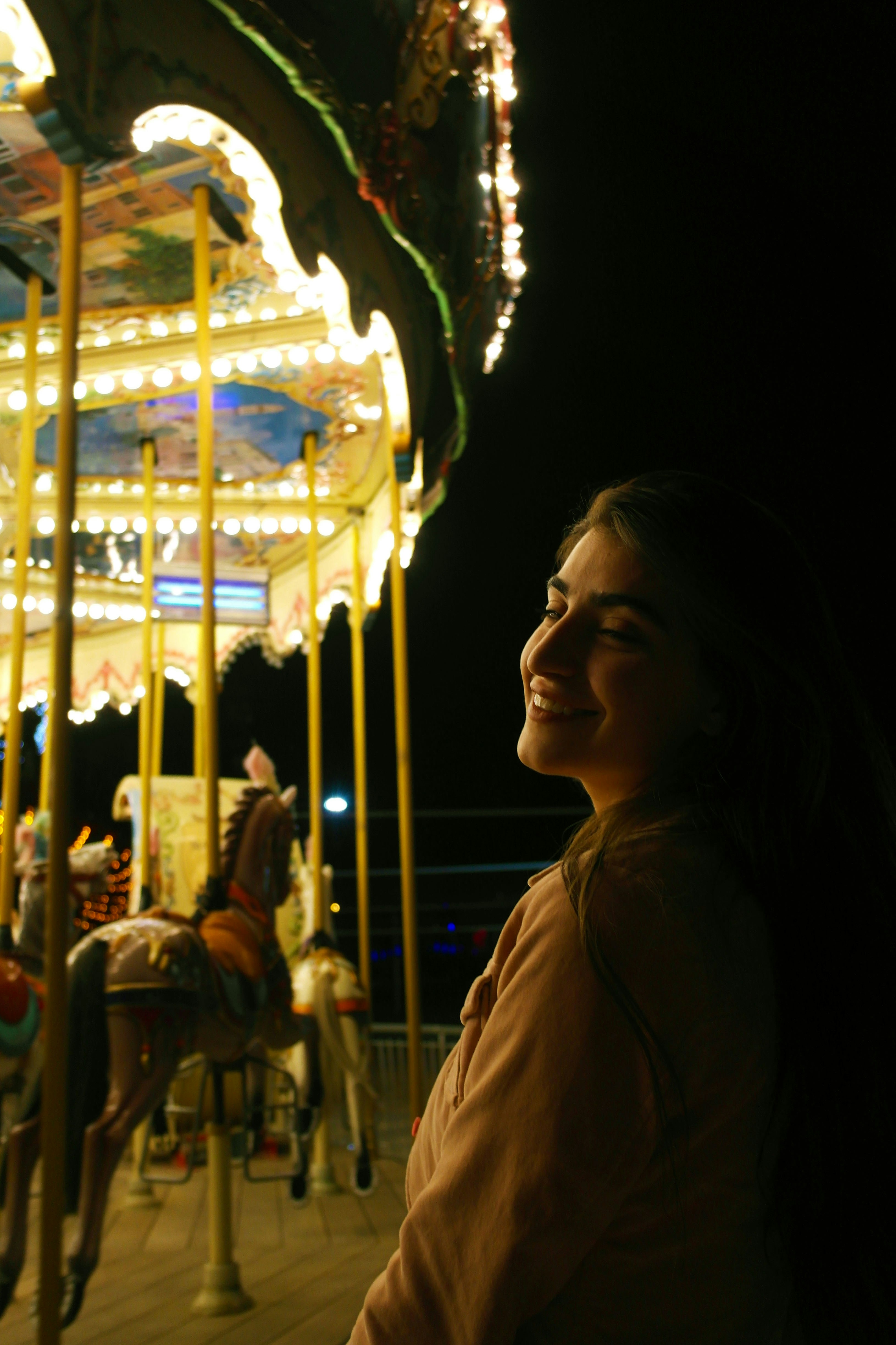 Night Carousel Glow: A Quiet Smile Amid Neon Rounds