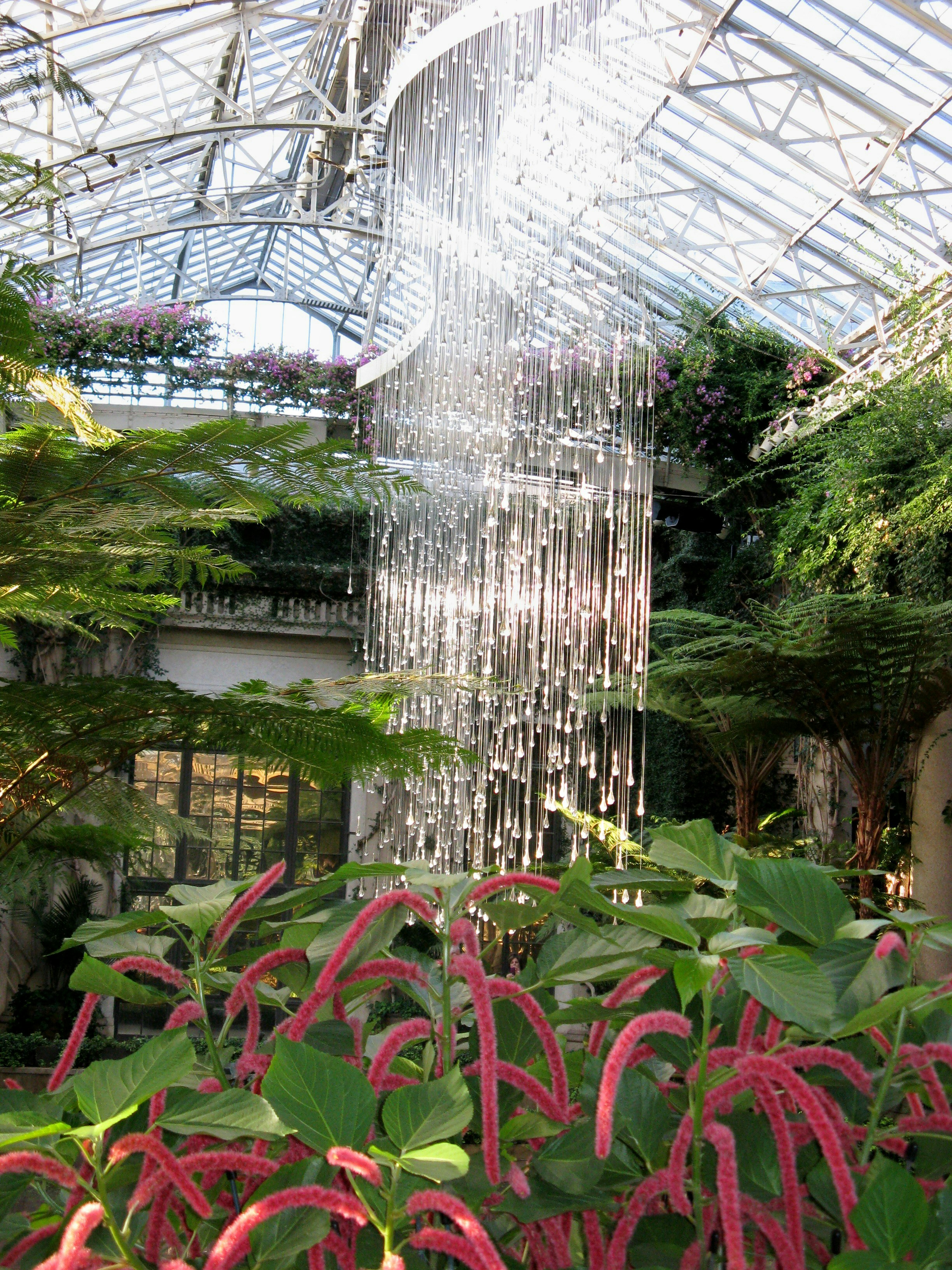 A very tall waterfall of water hanging from a ceiling photo – Free ...