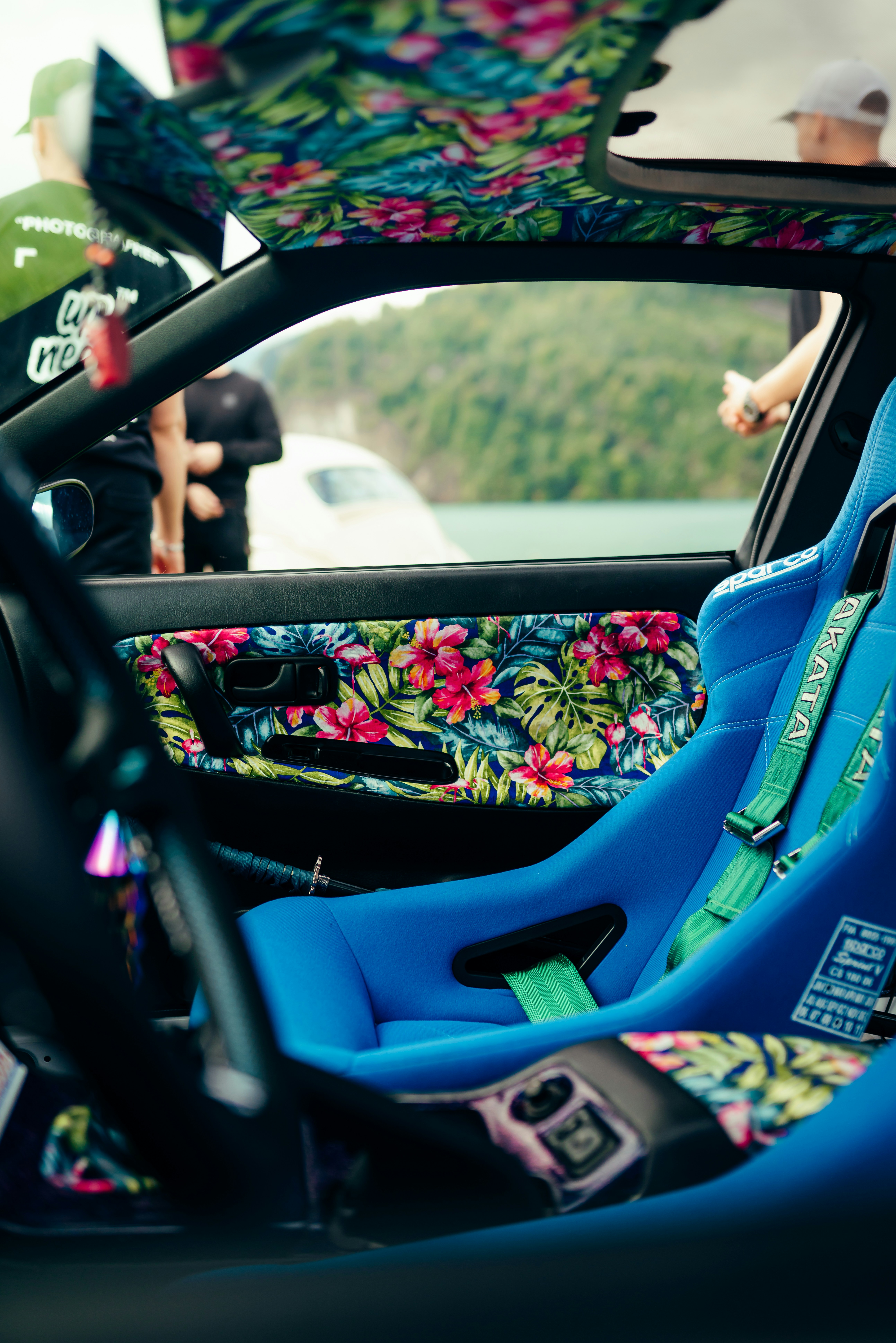 Kaleidoscope Cockpit: Floral Flair Meets Blue Racing Seat