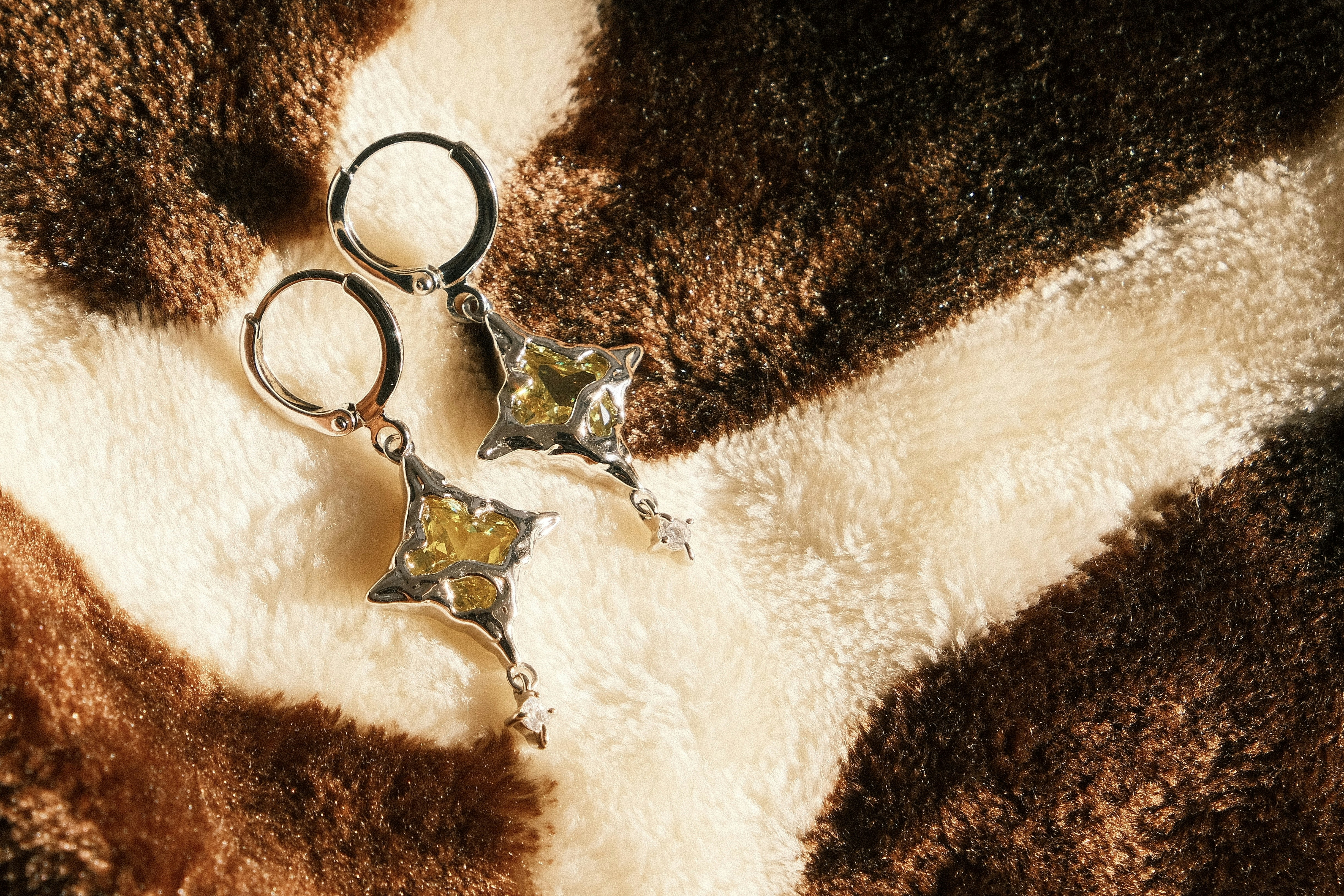 Facet-Glint Earrings on Cocoa Velvet: A Close-Up Jewelry Portrait