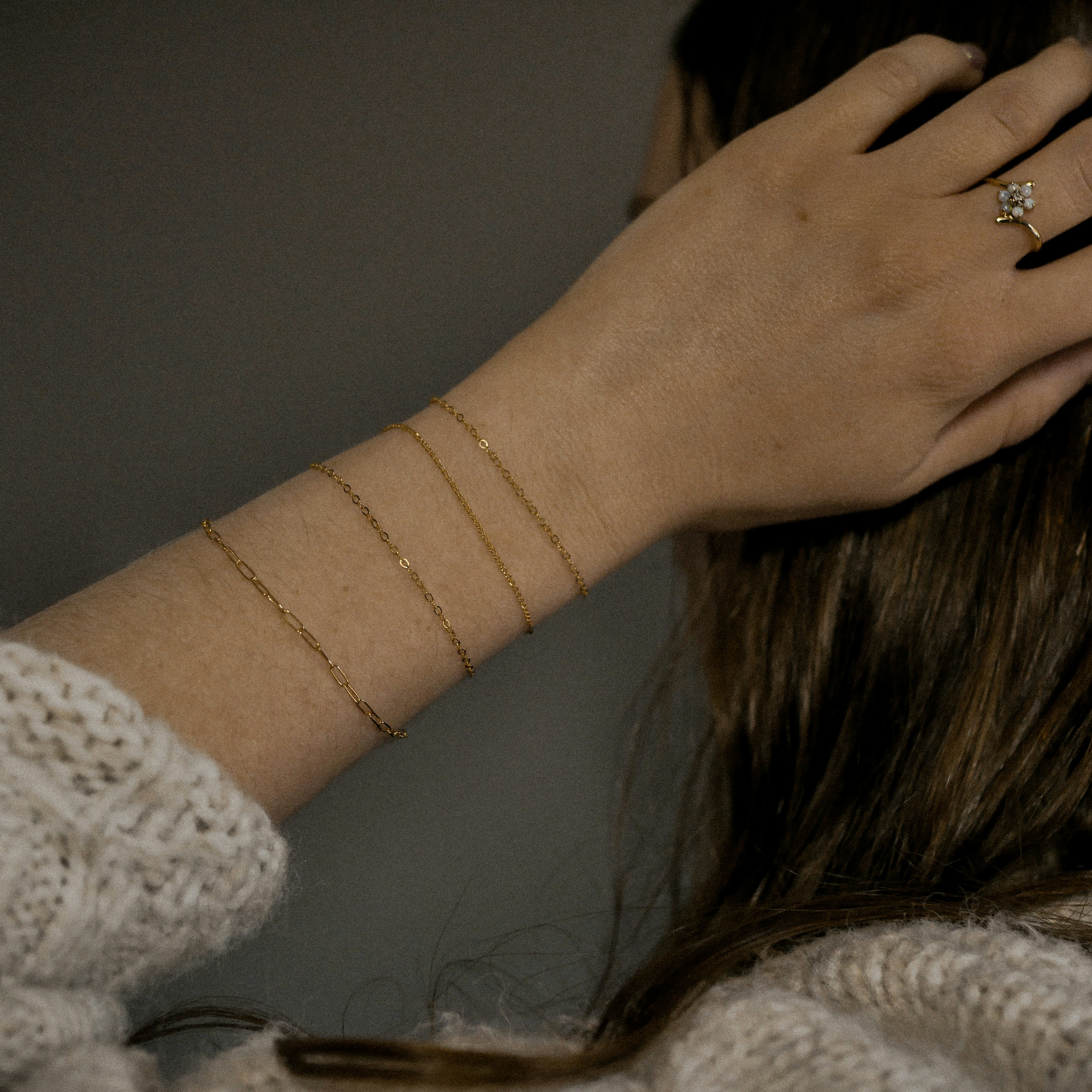 A woman wearing a gold bracelet and a diamond ring photo – Free Woman ...