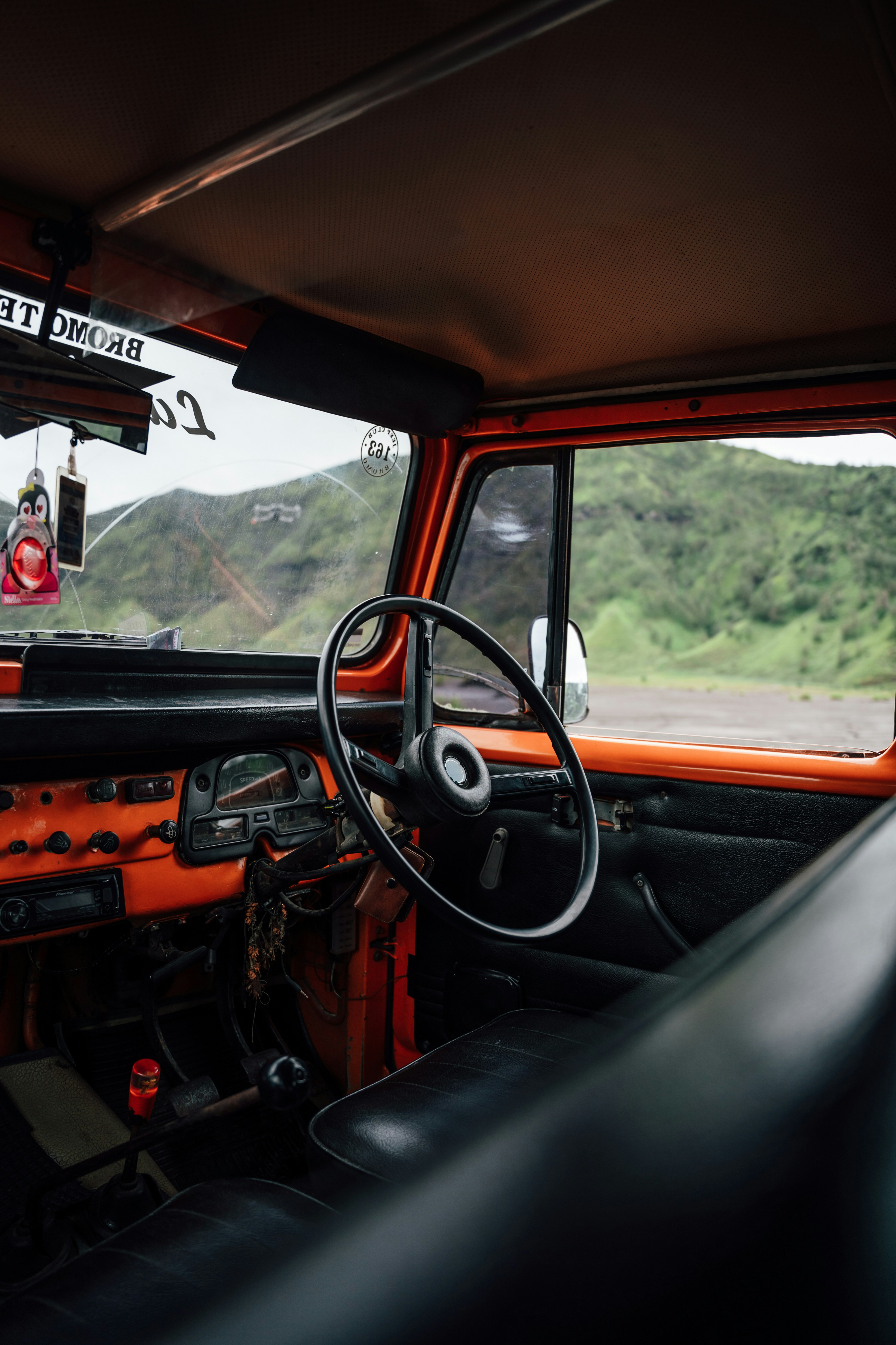 Orange Dash, Quiet Horizon: Inside a Retro Vehicle