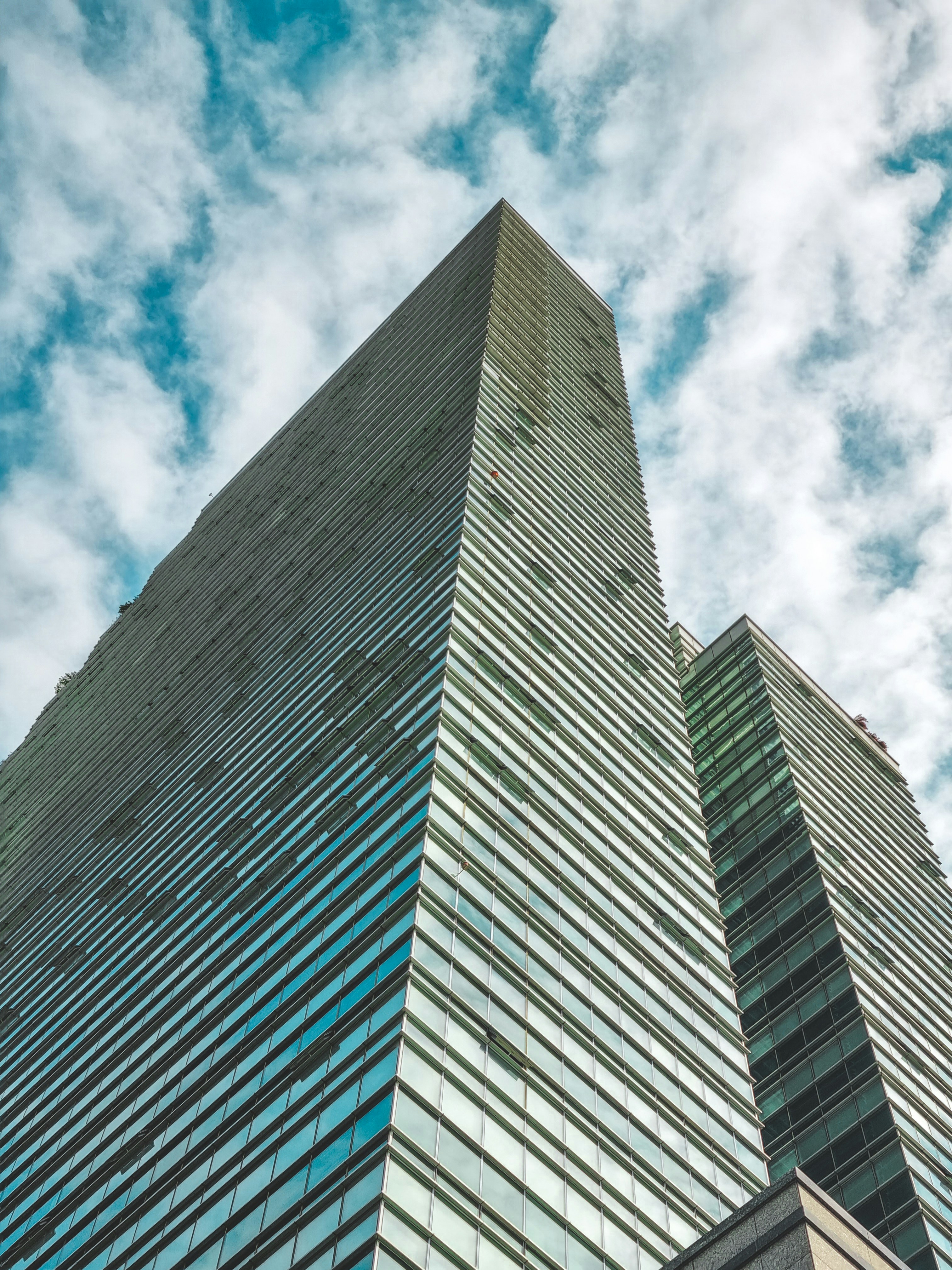 A very tall building with a sky background photo – Free Cyan sky Image ...
