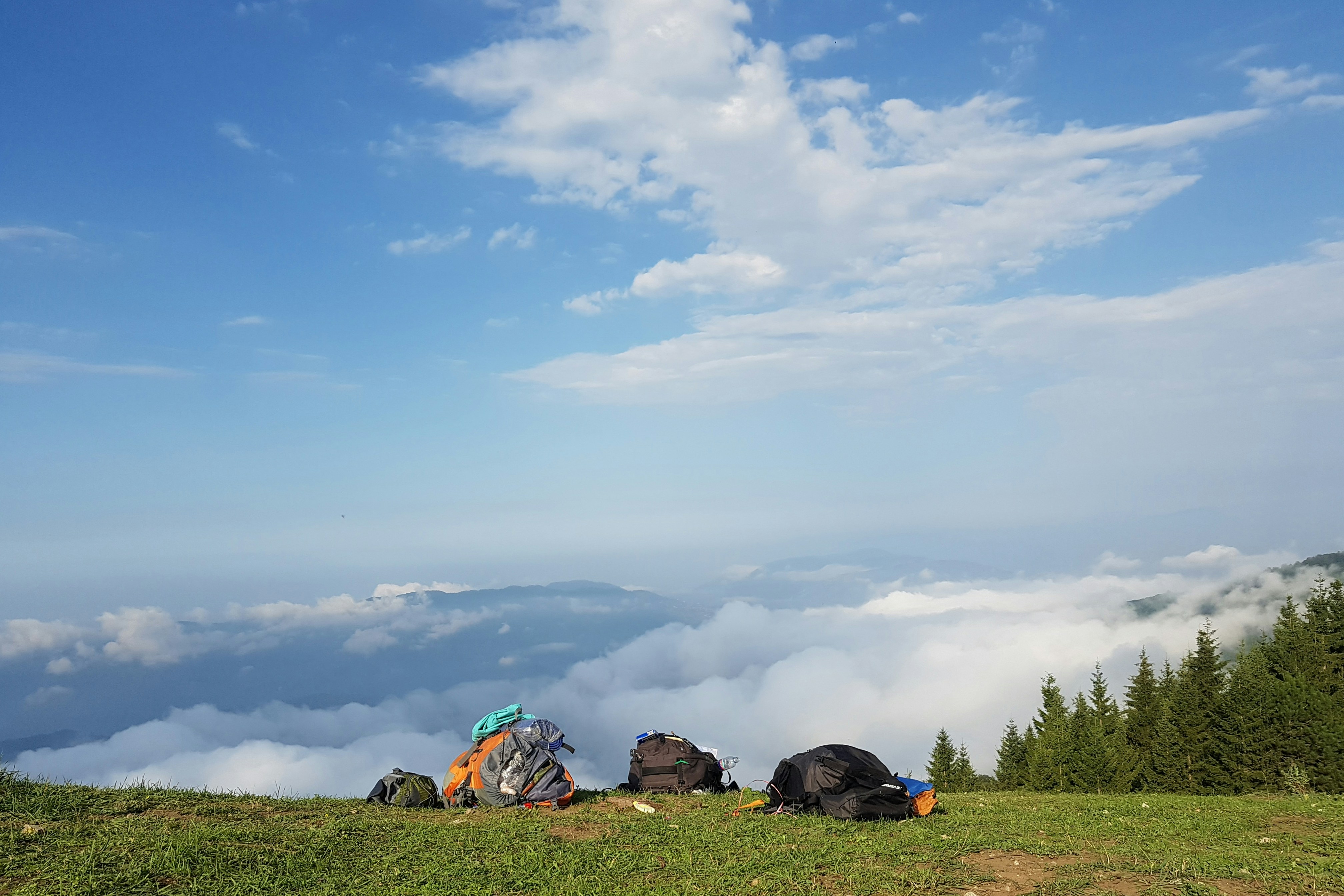 Ridge Camp Gear Resting on the Edge of a Sea of Clouds
