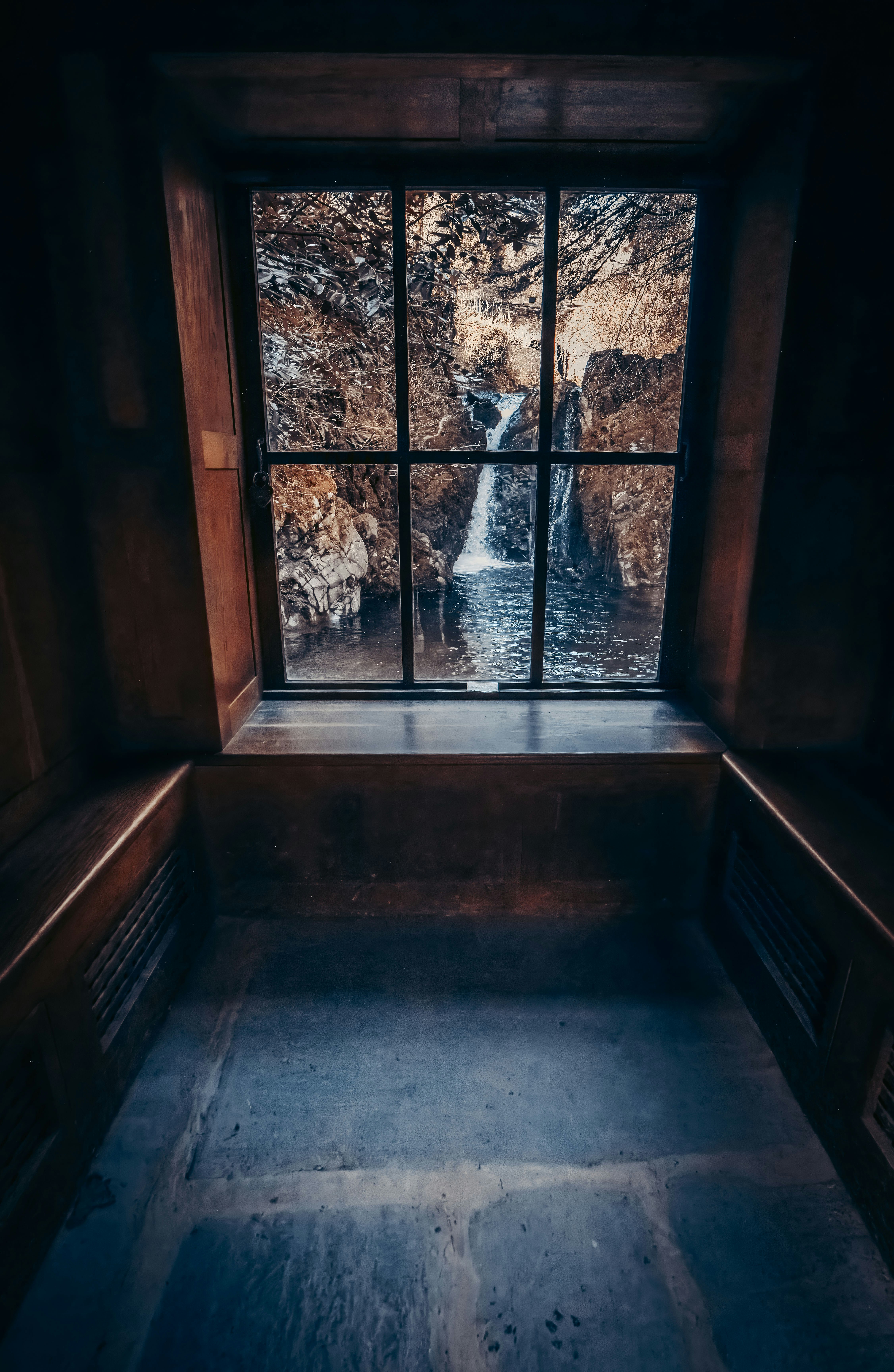 A window with a view of a waterfall photo – Free Rydal Image on Unsplash