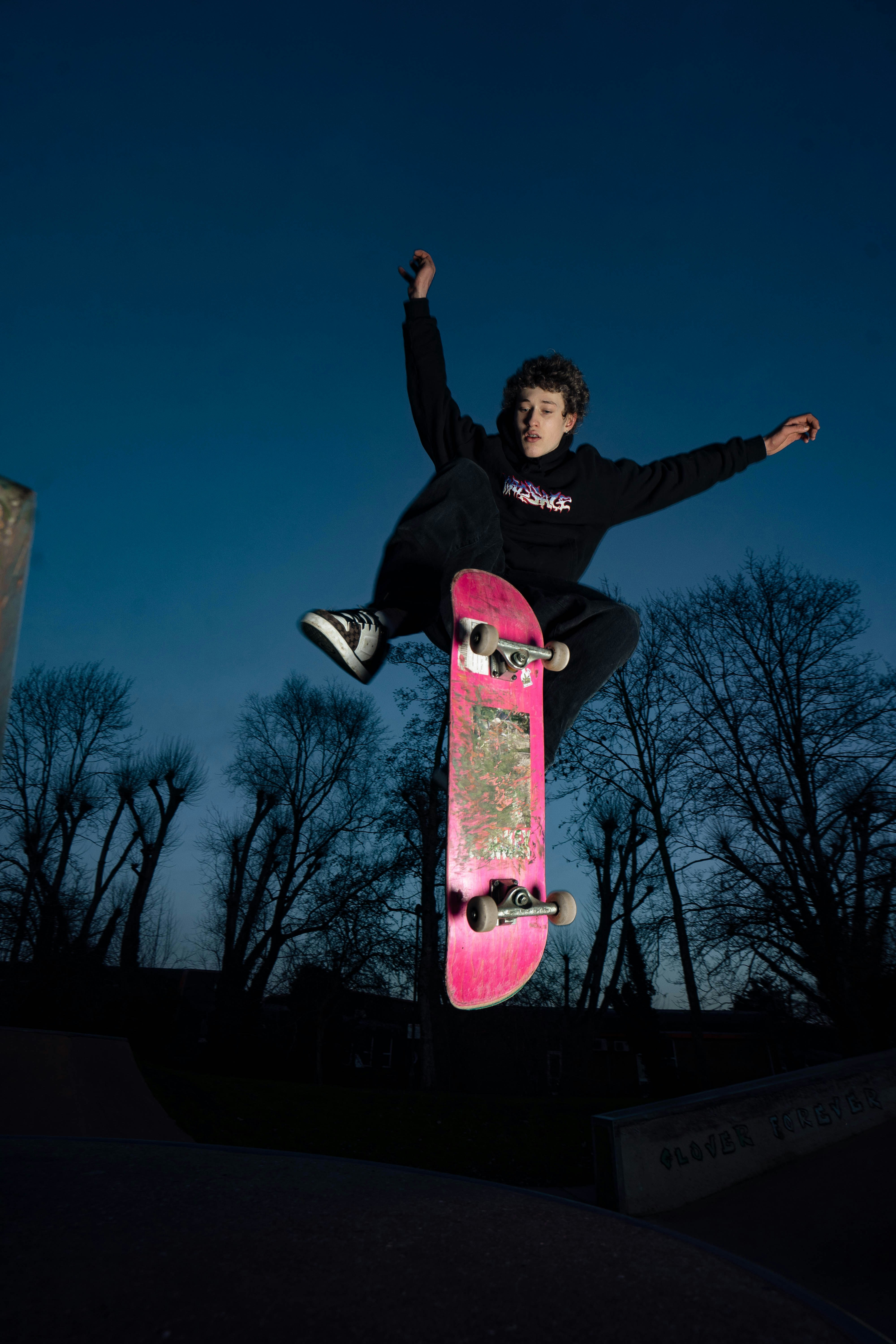 A man flying through the air while riding a skateboard photo – Free ...