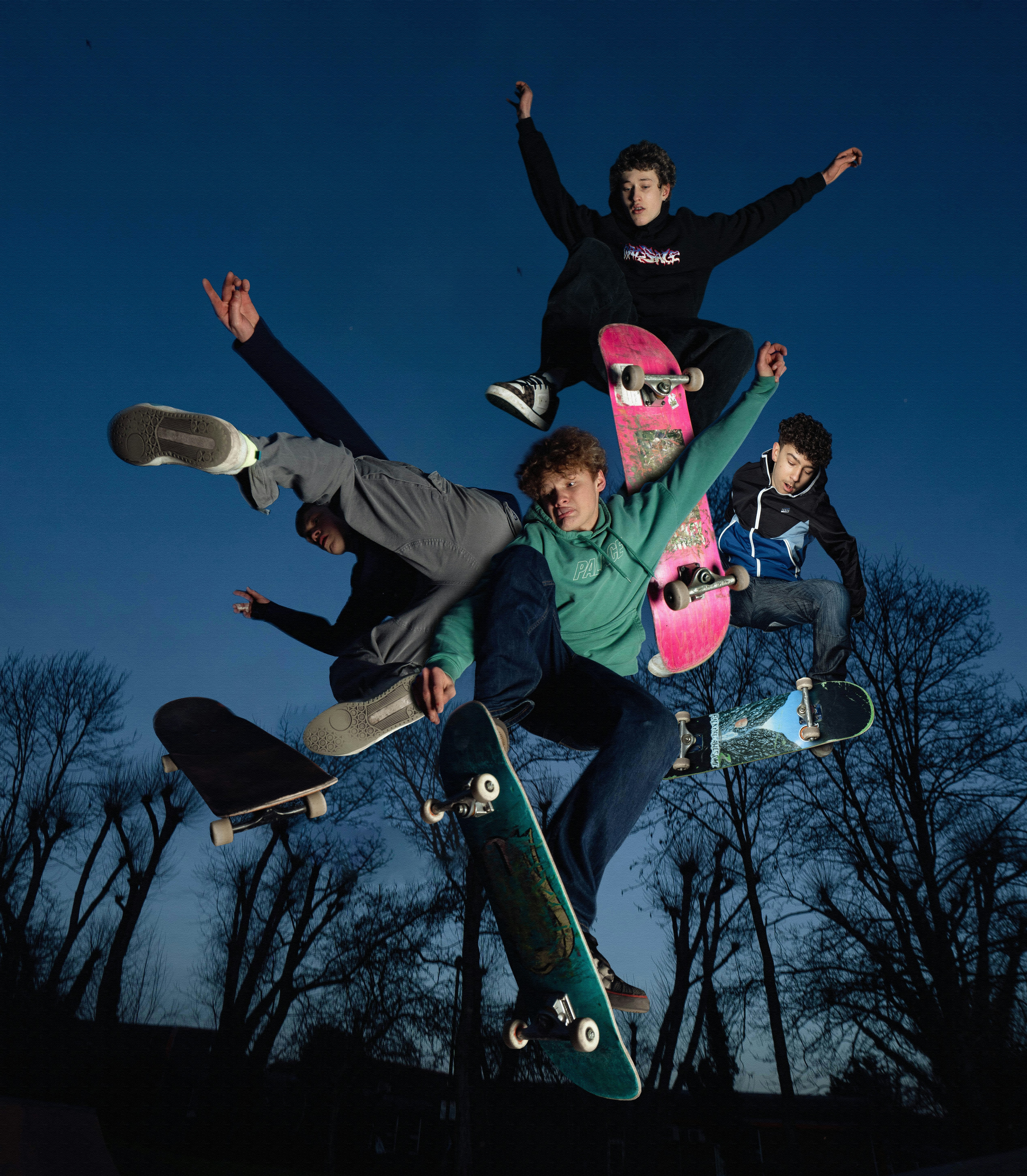 A group of skateboarders doing tricks in the air photo – Free ...