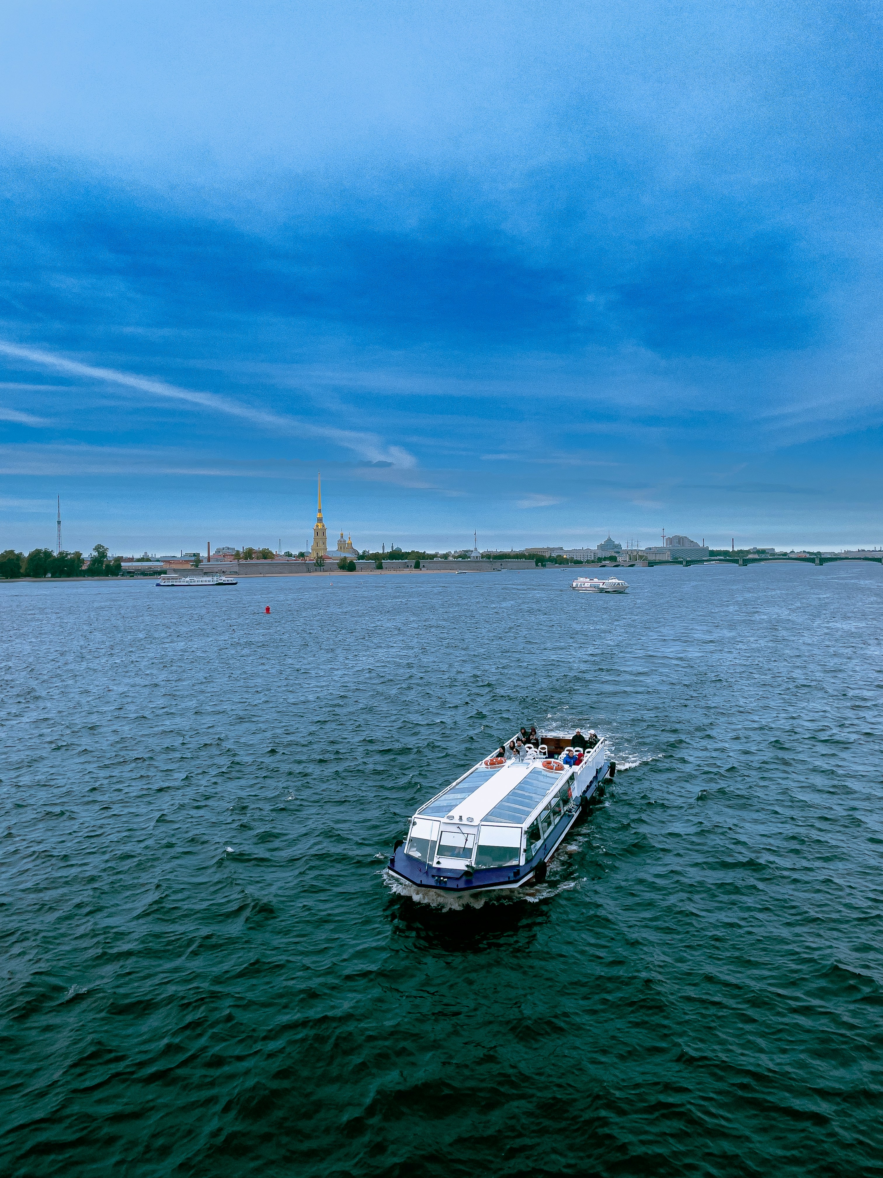 Dawn over the Neva: A Boat Slips Through Calm Waters