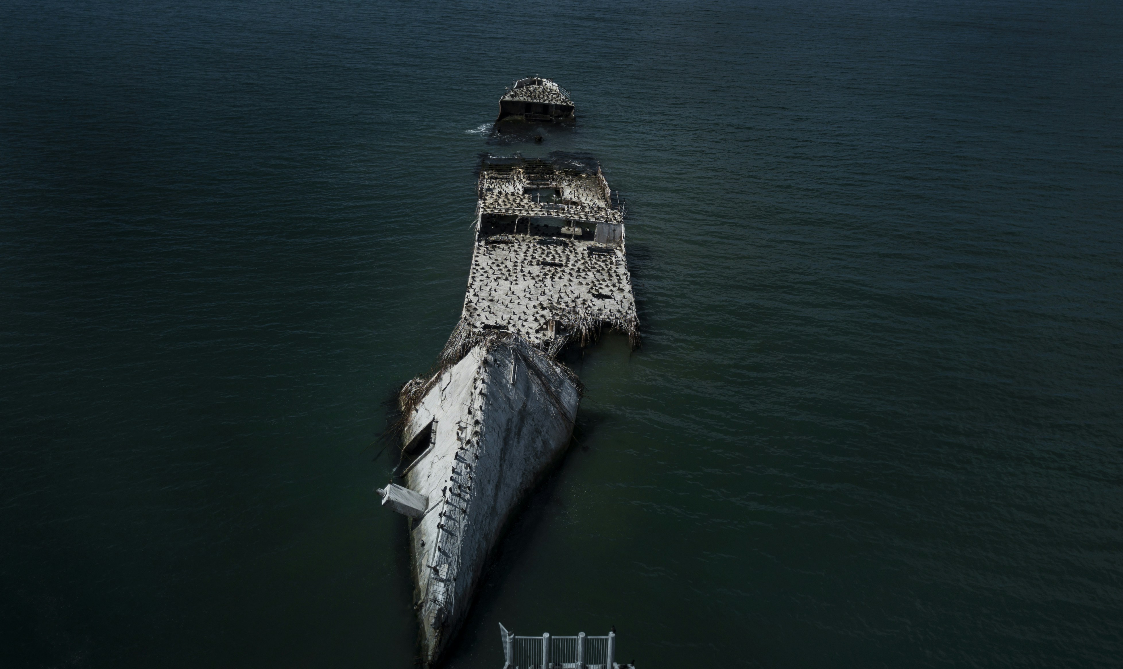 a large boat floating on top of a body of water