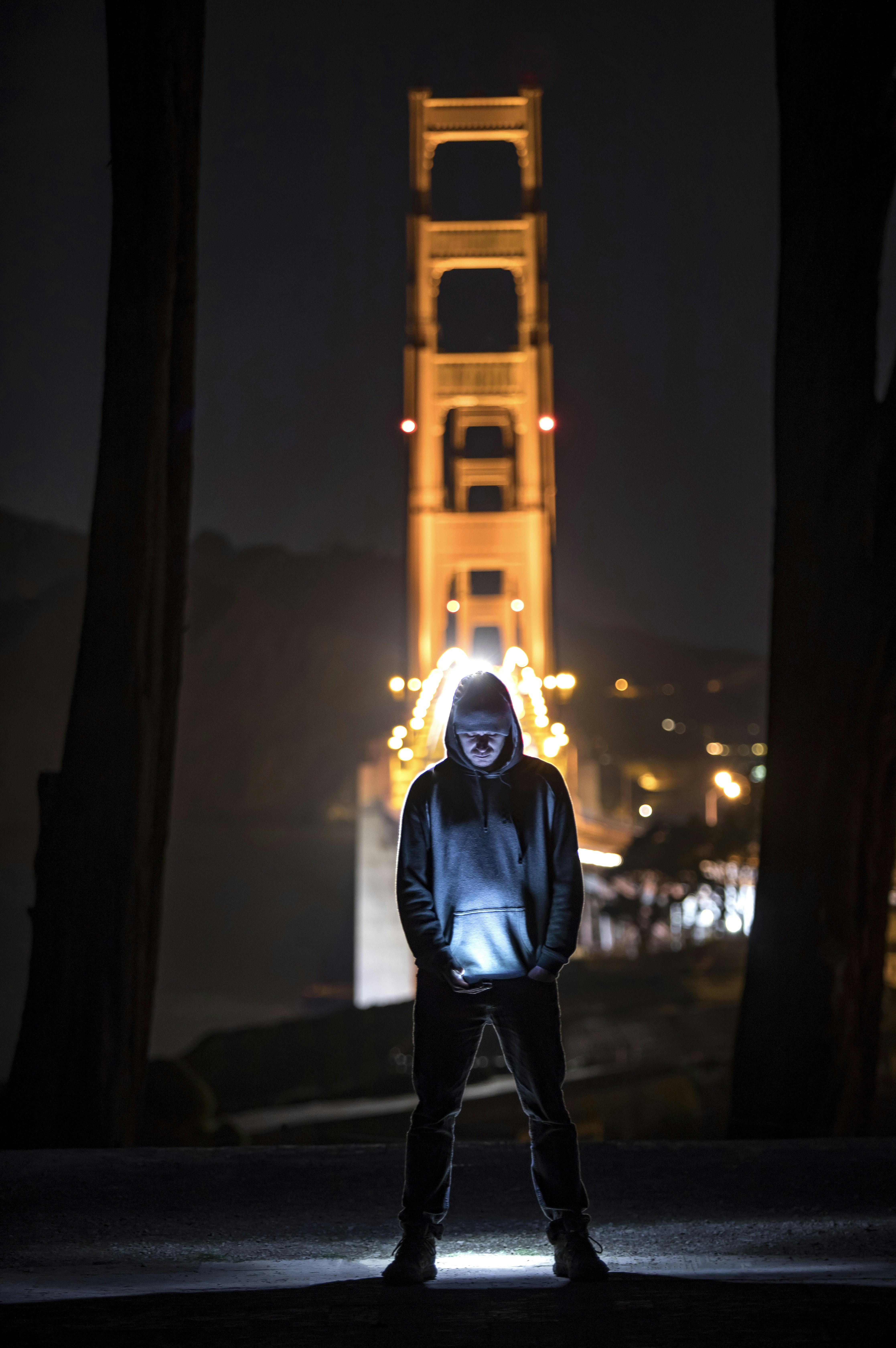 Hooded Figure under Golden Gate Lights