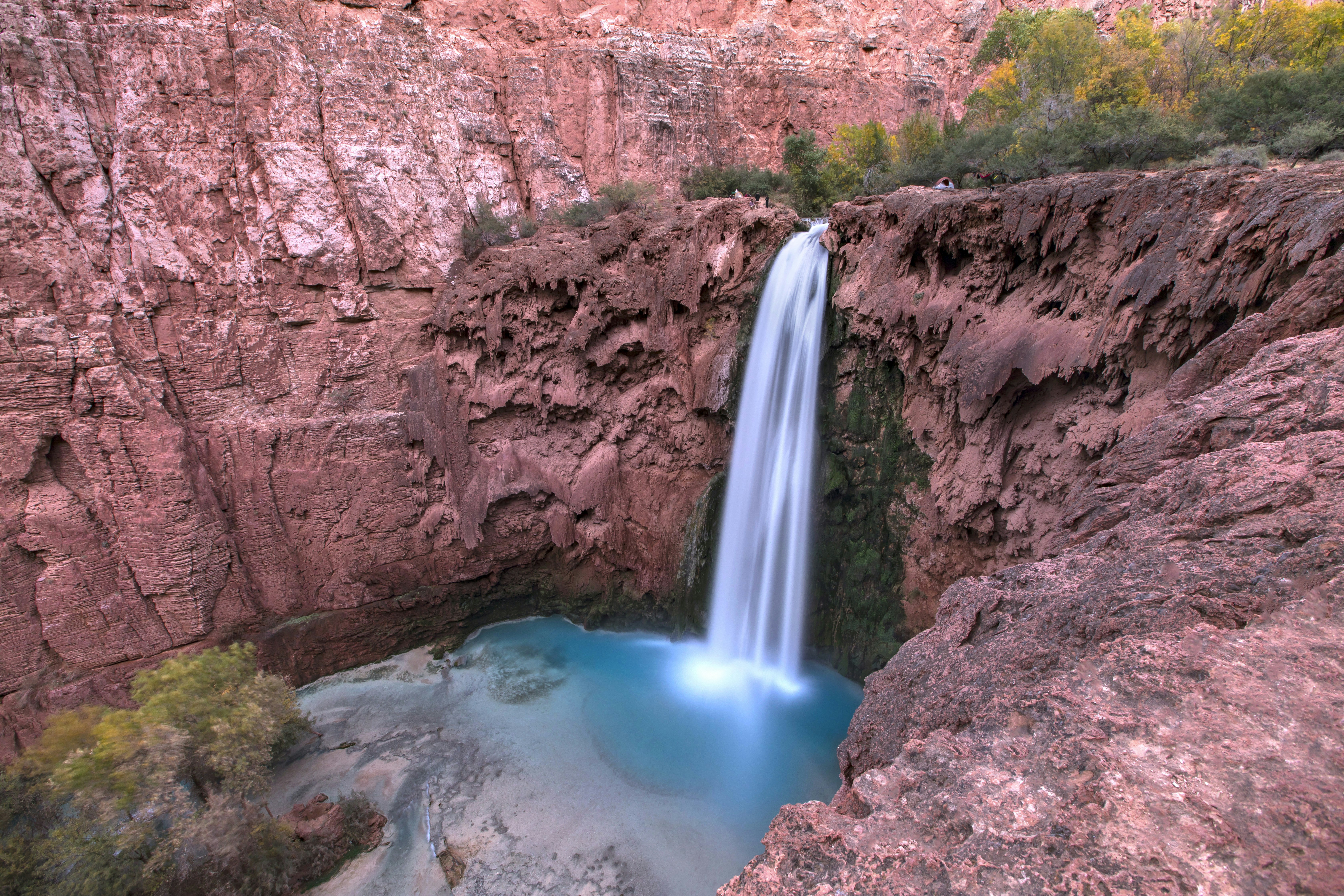 A waterfall with a blue pool in the middle of it photo – Free Supai ...