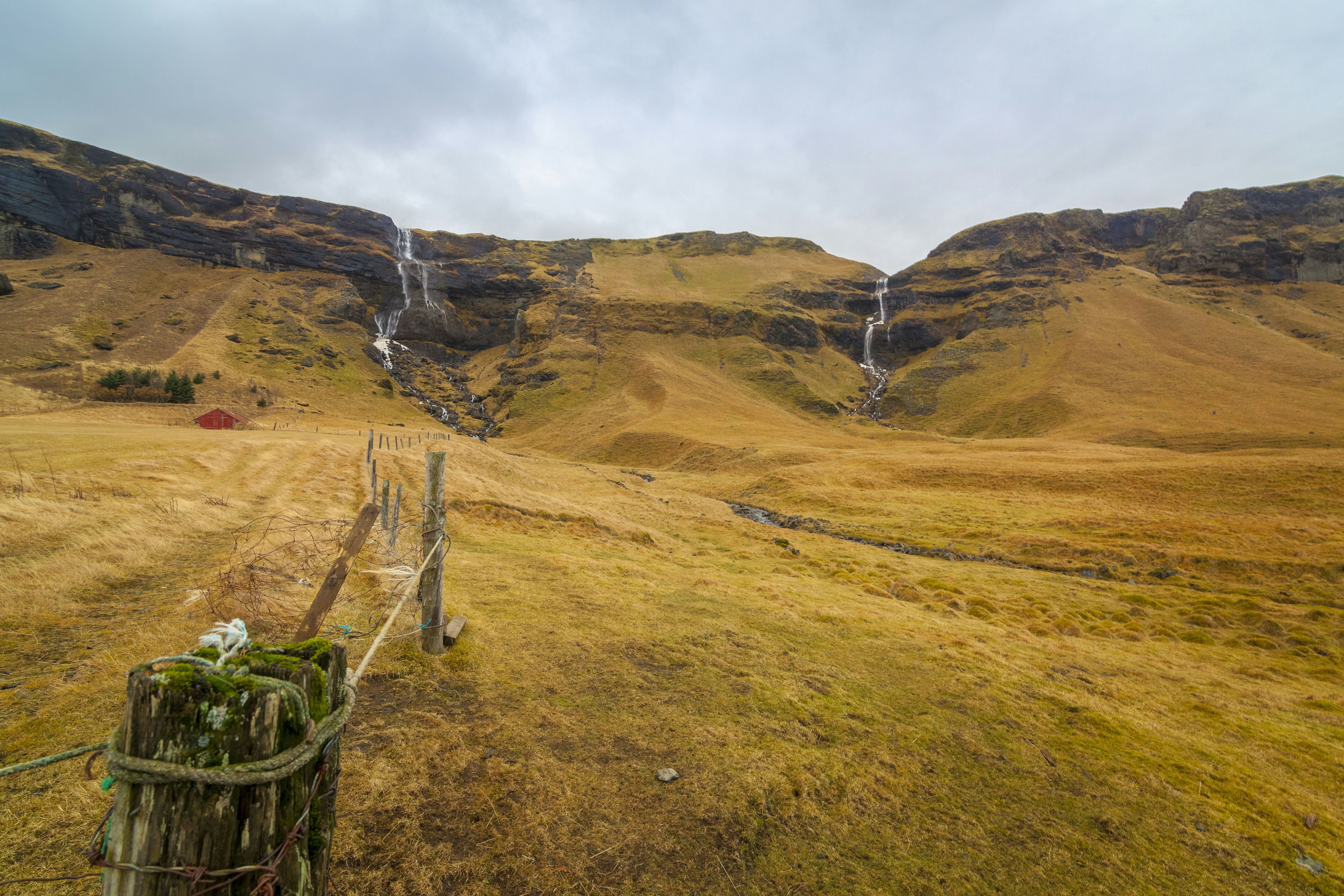 Twin Falls Moor: A Weathered Fence Guides the Golden Valley Toward Cliffside Cascades