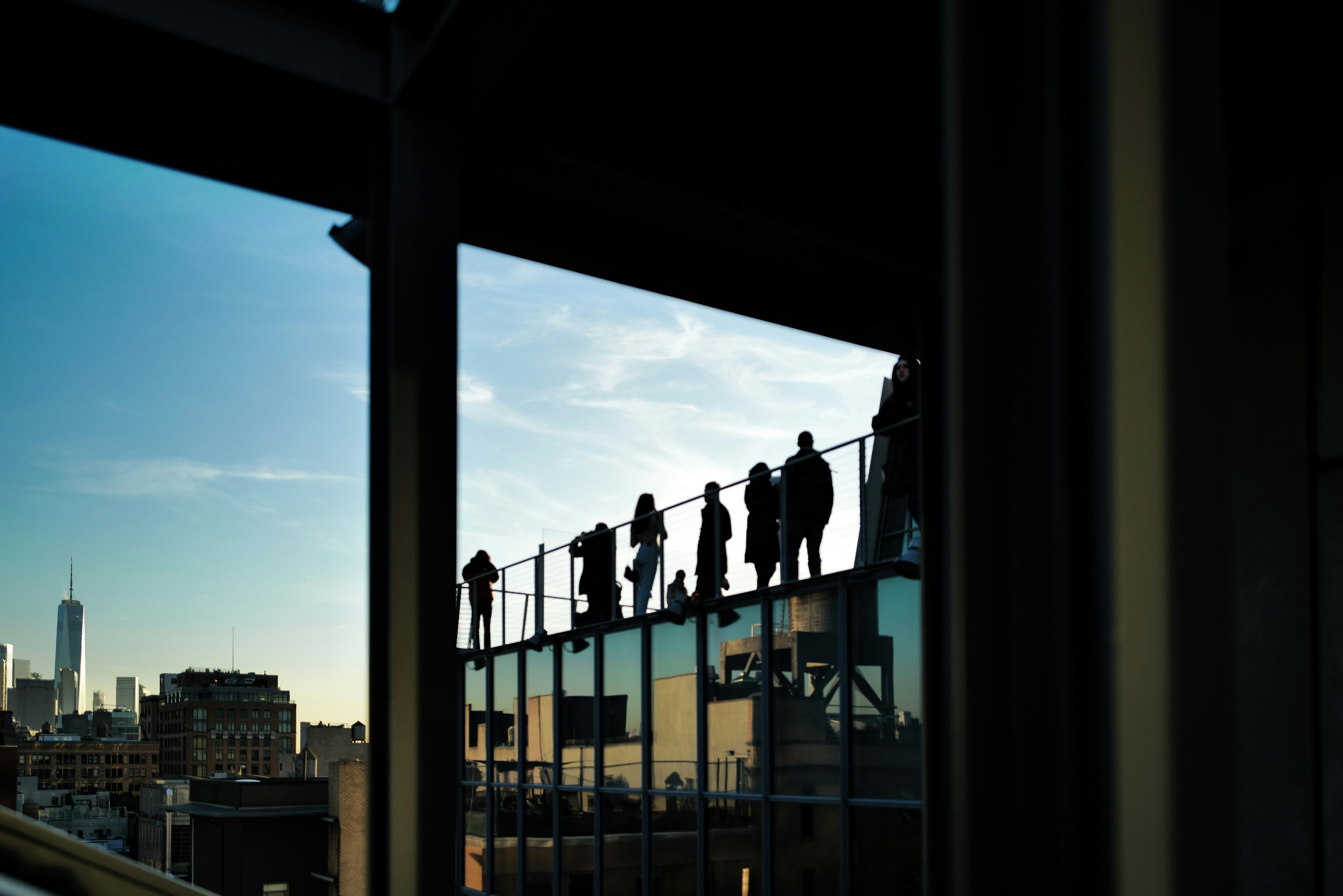 Rooftop Silhouettes Against a Distant Skyline at Blue Hour