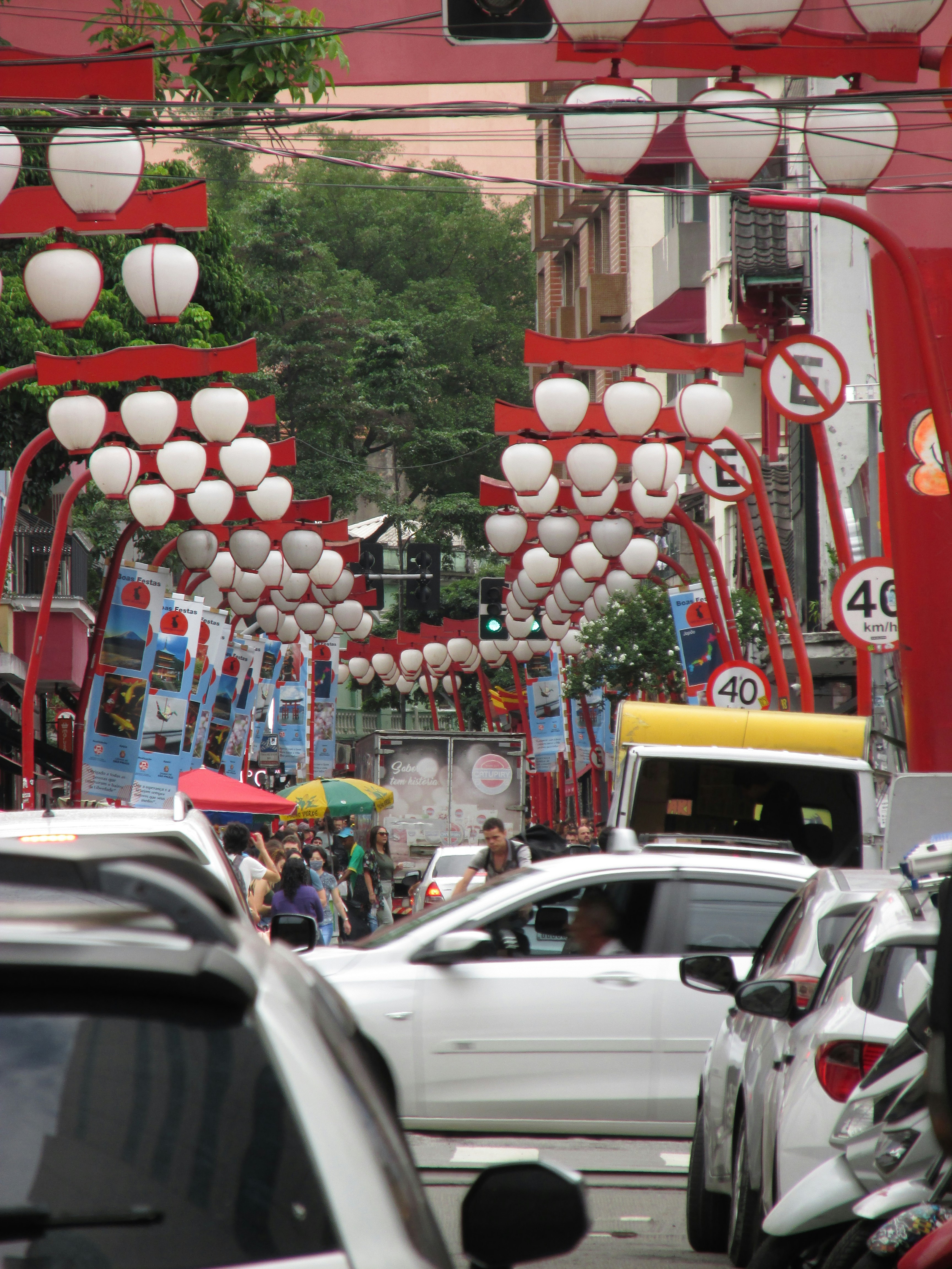 Lantern-lined Street in a Busy Urban Market