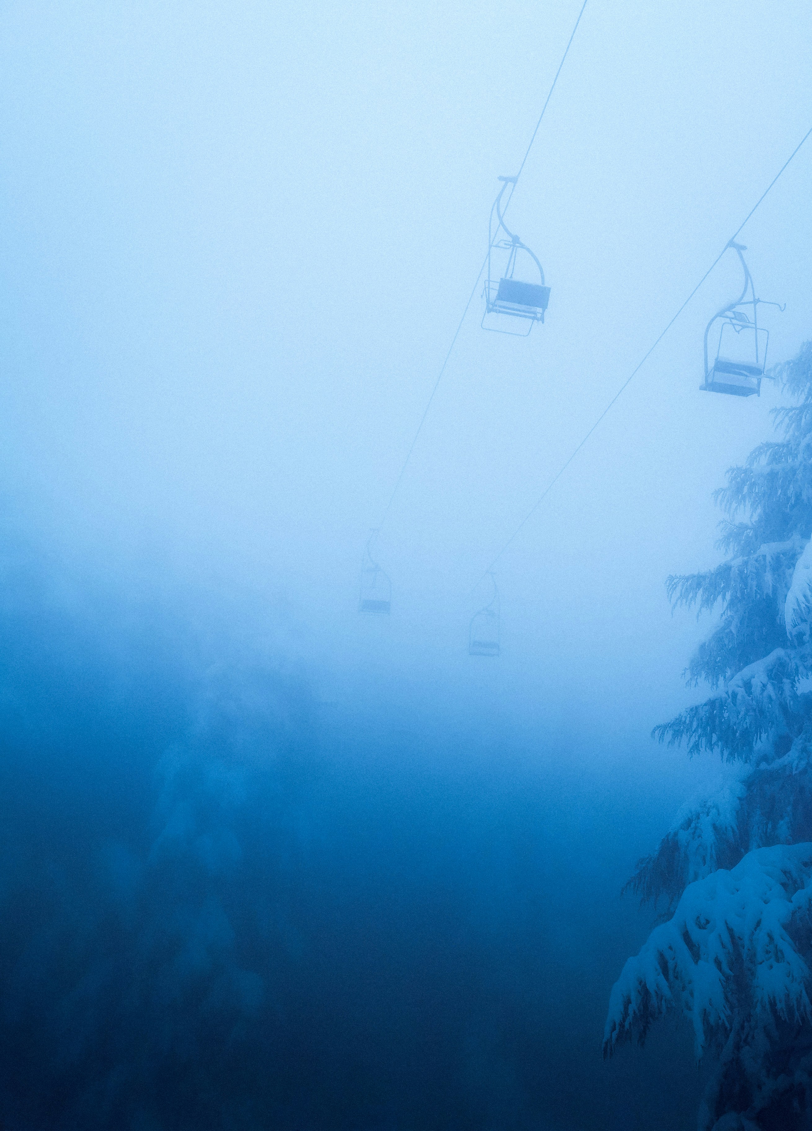 Blue Silence Above the Fog: A Cable Car Scene