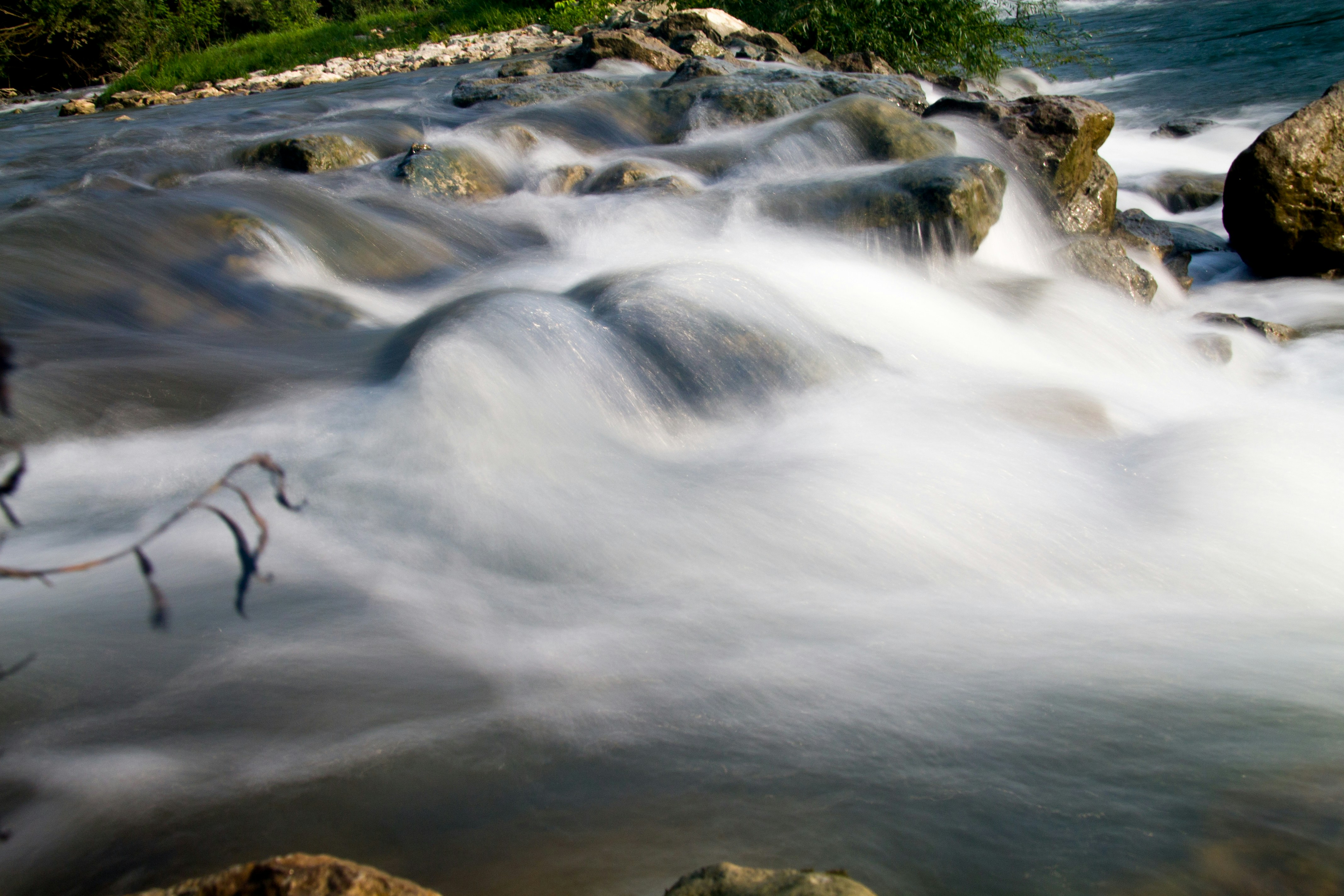 A stream of water running over rocks in a river photo – Free River ...