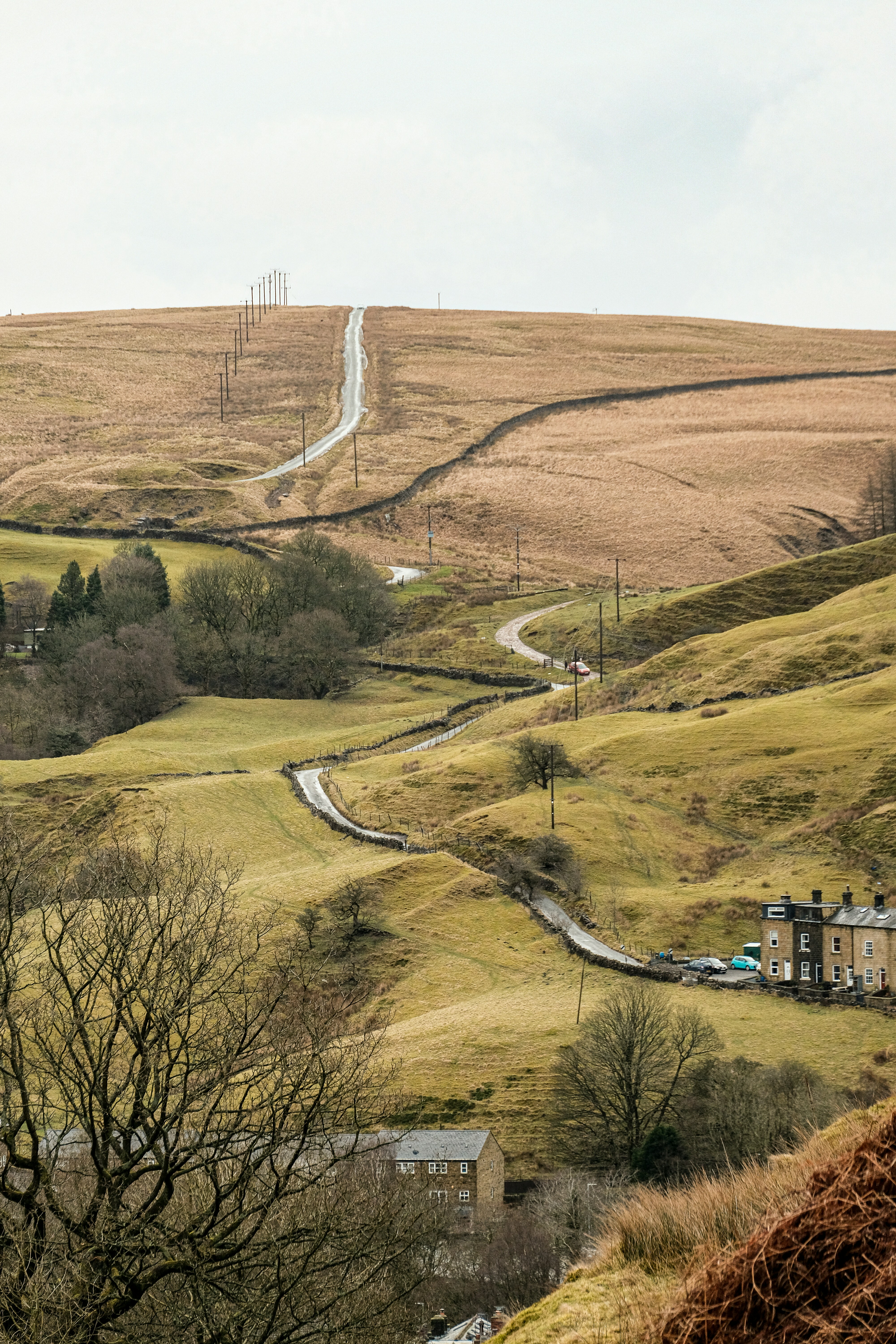 A winding road in the middle of a hilly area photo – Free Wallpaper ...