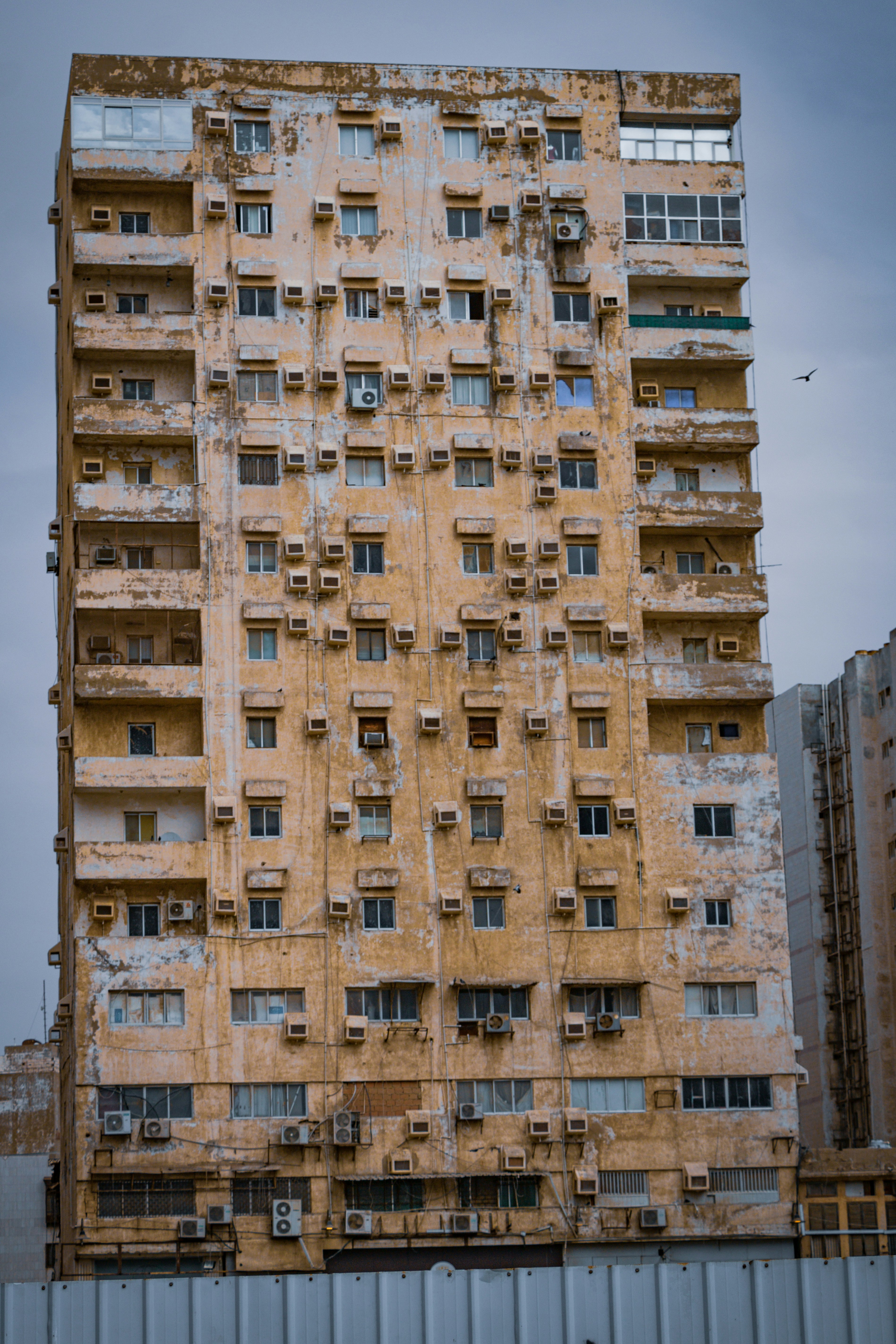 a tall building with lots of windows and balconiesJoão Reguengos