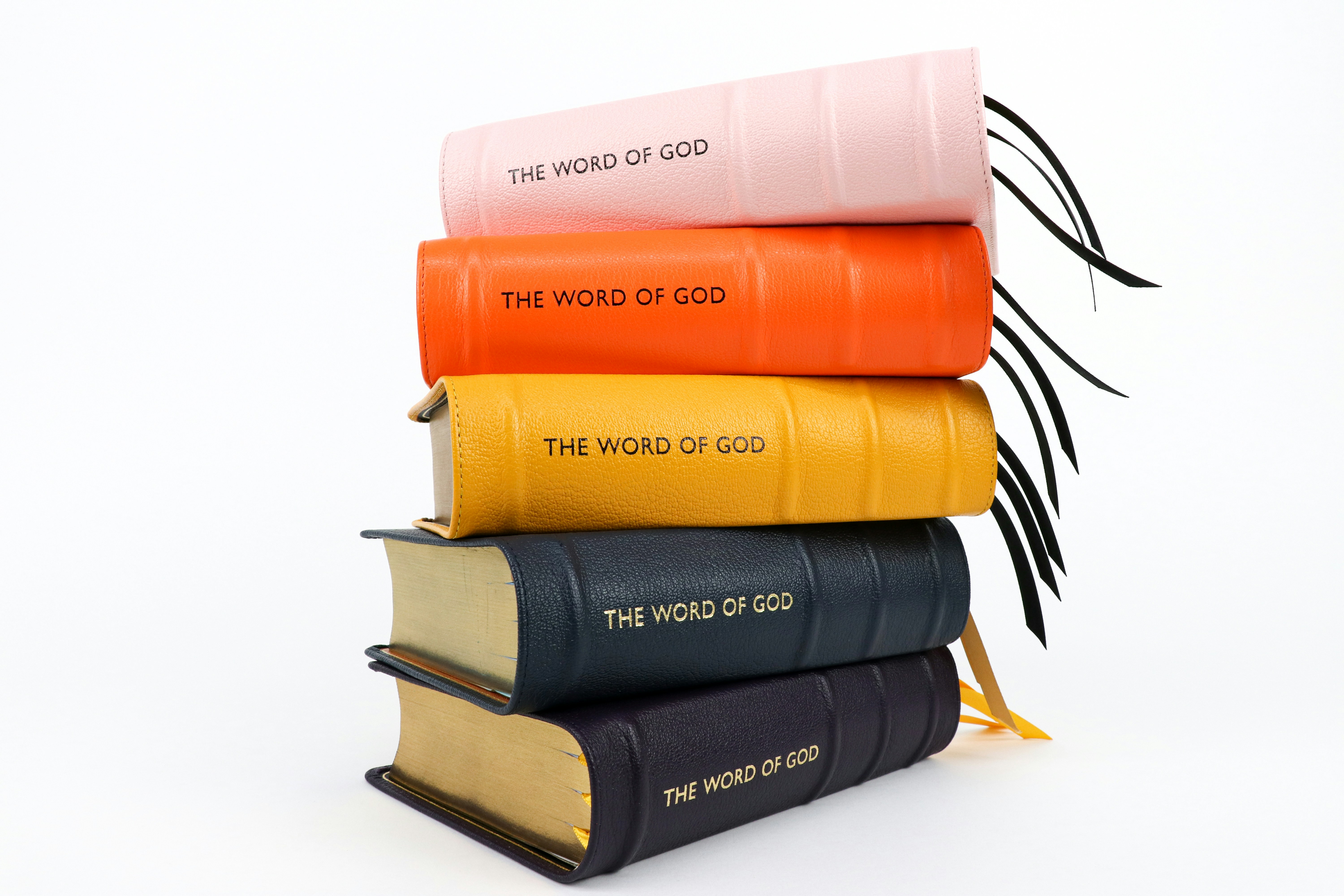 A stack of books with a tassel on top photo – Free White background ...