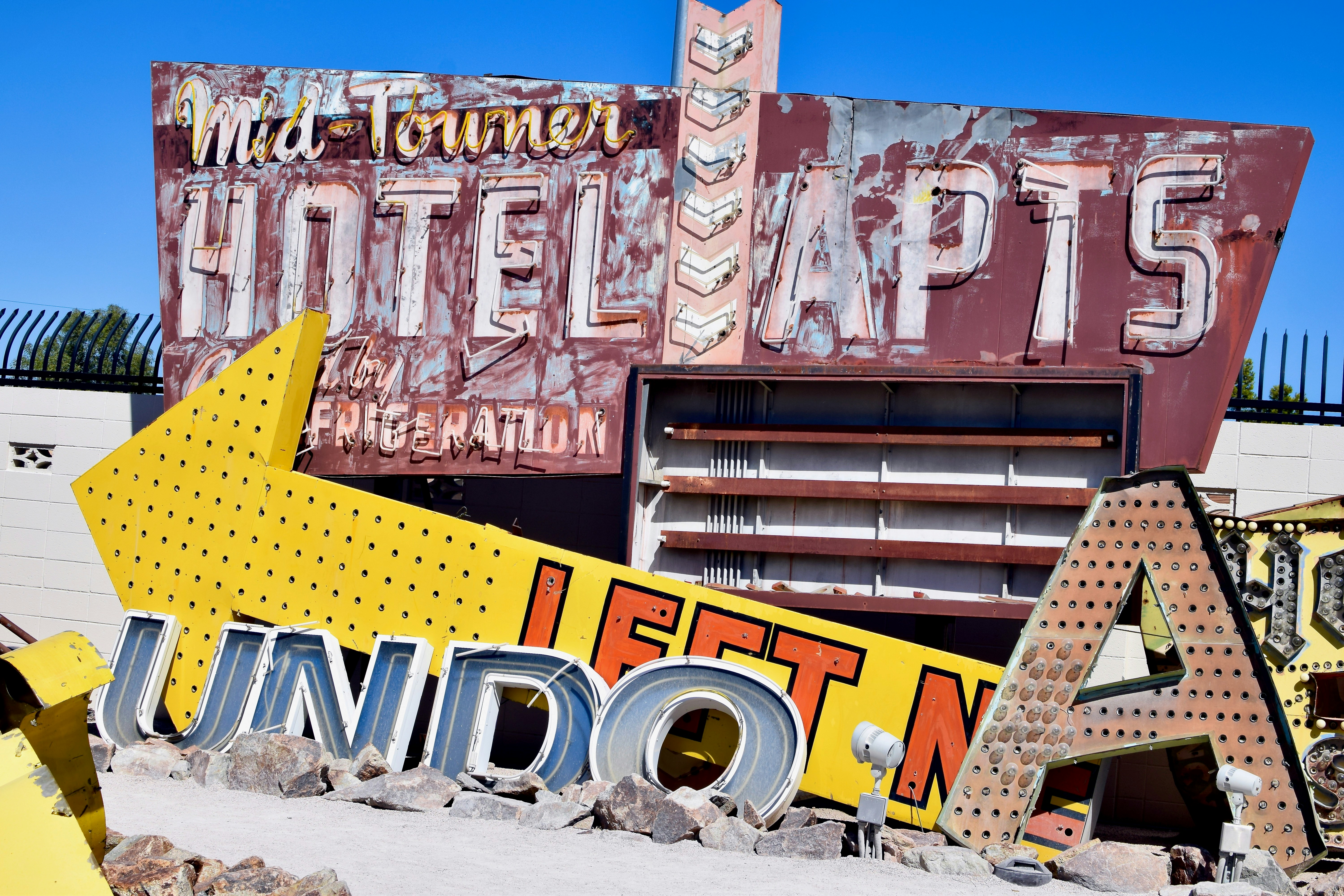 A bunch of signs that are on the side of a building photo – Free Old ...