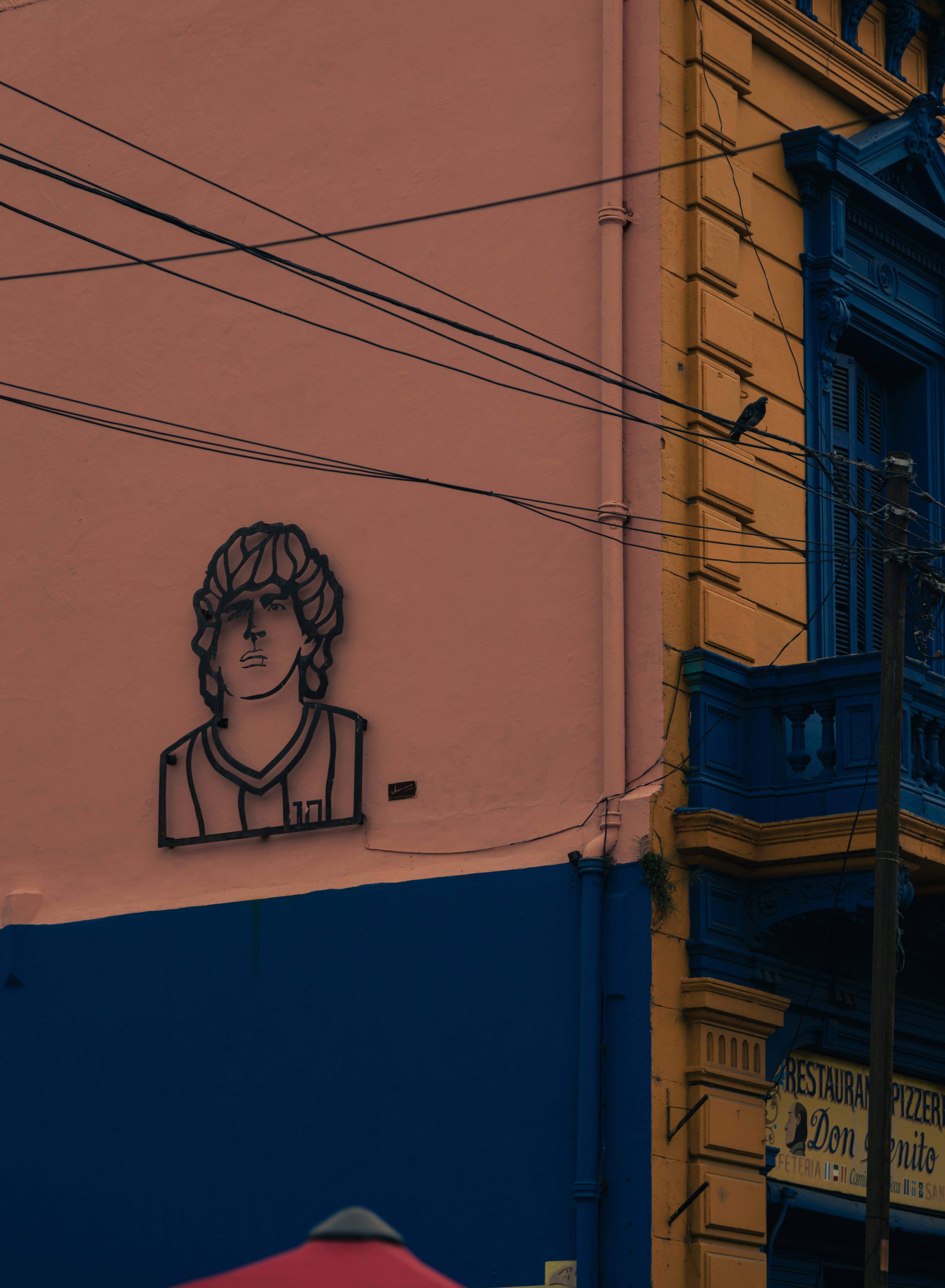 Line Art on a Pastel Street Wall: Portrait Between Blues and Yellows