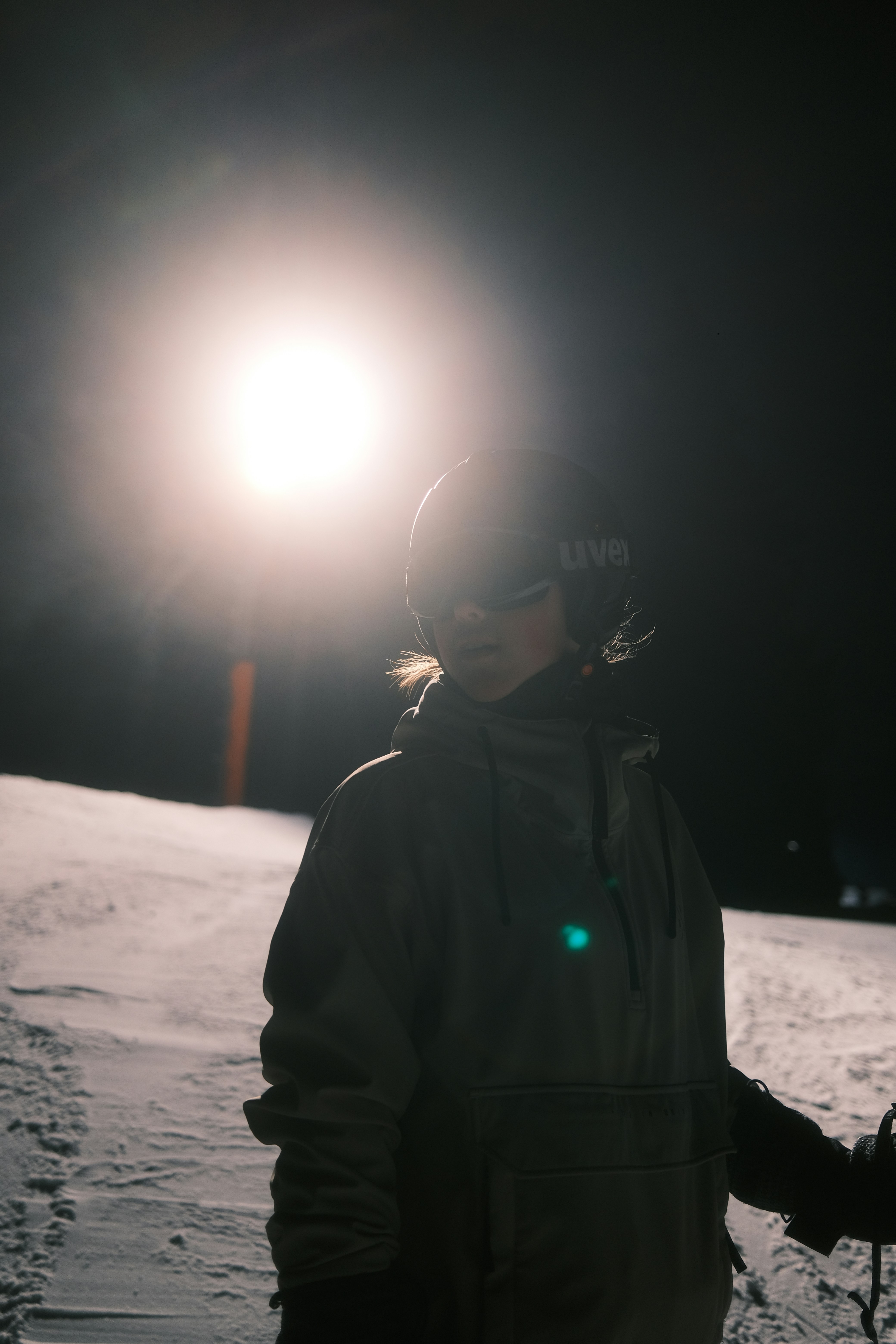 Halo on the Slopes: A Night Portrait of a Backlit Skier