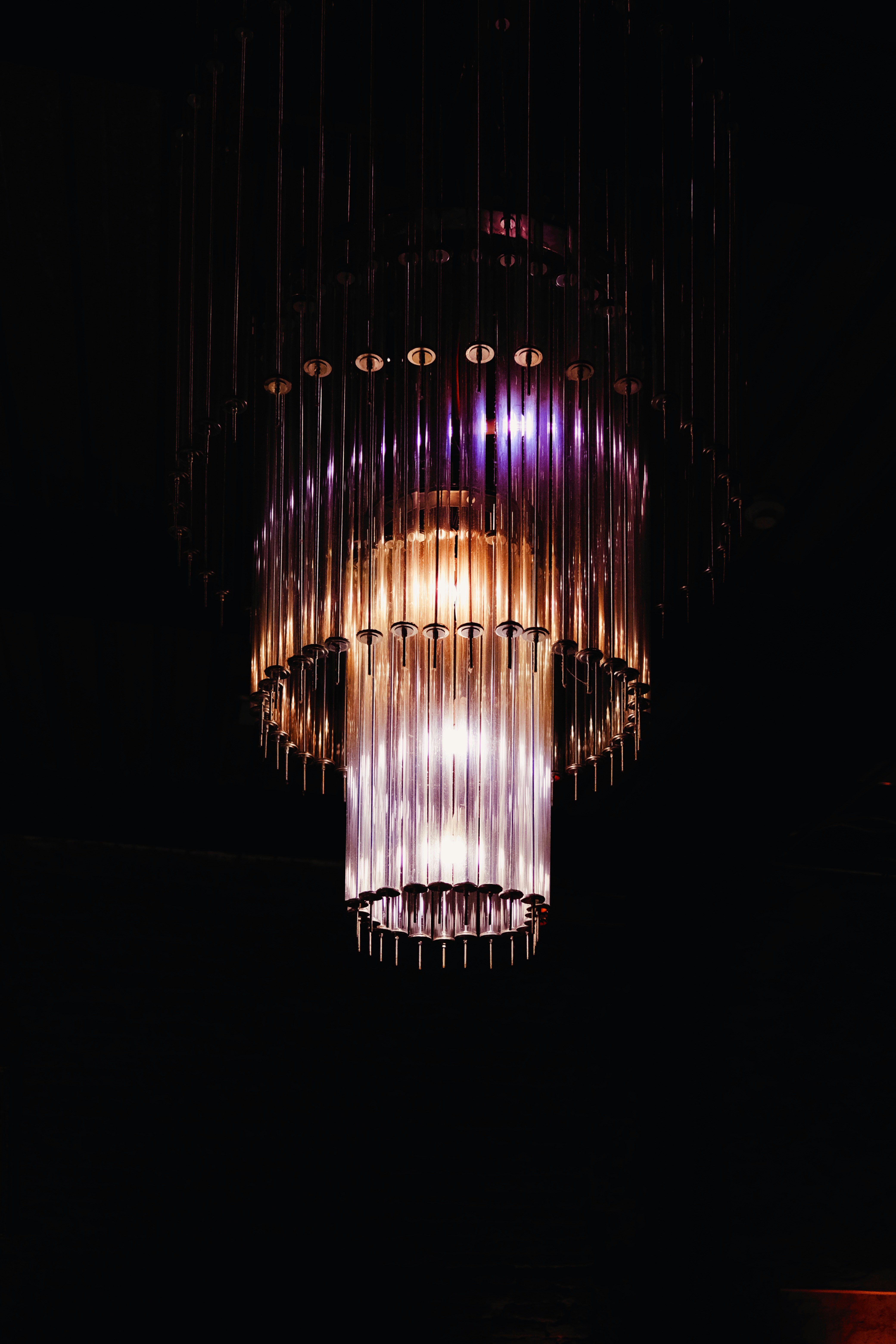 Crystal Curtain Halo: A Purple-and-Amber Chandelier in a Midnight Room