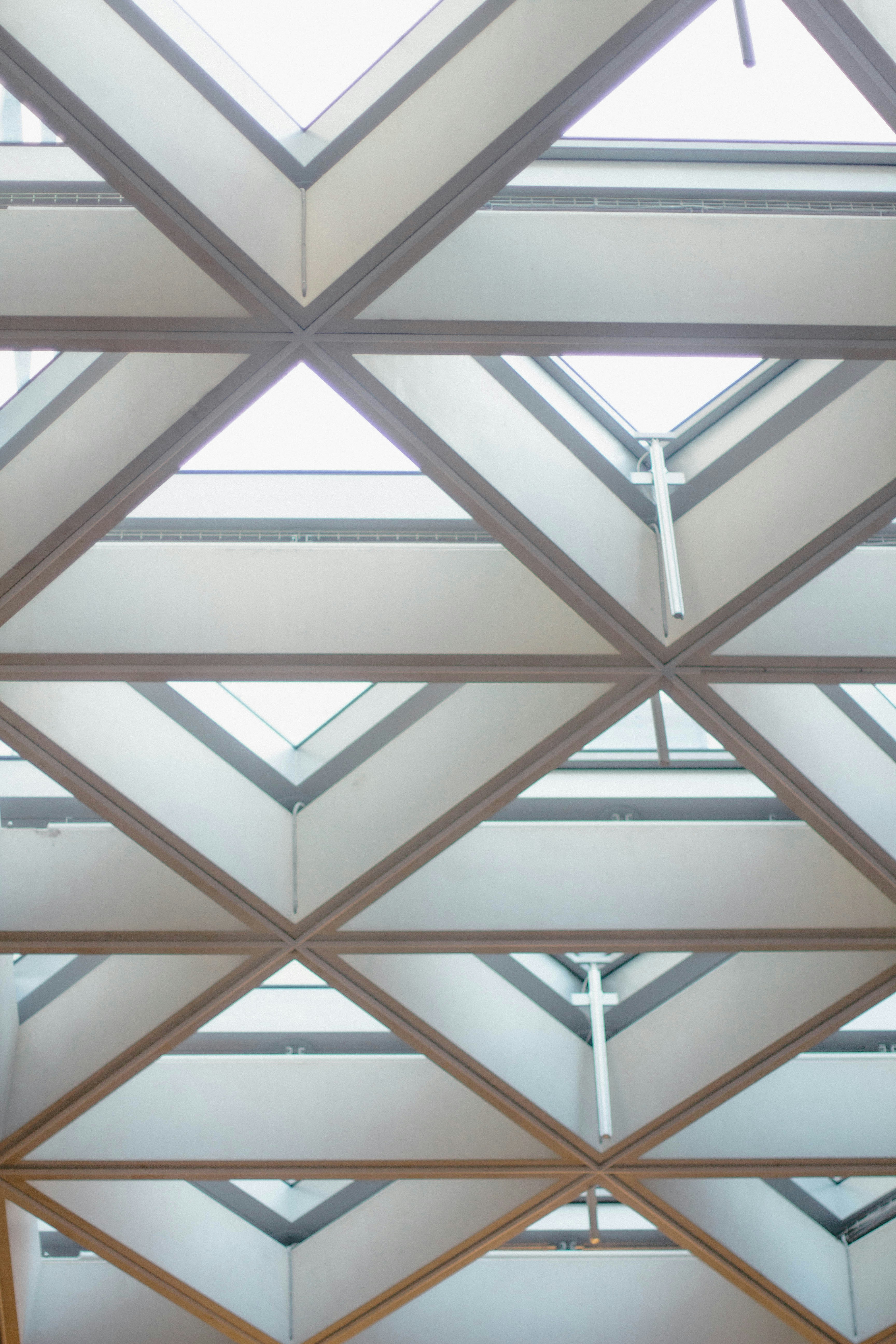The ceiling of a building with a clock on it photo – Free Ceiling ...