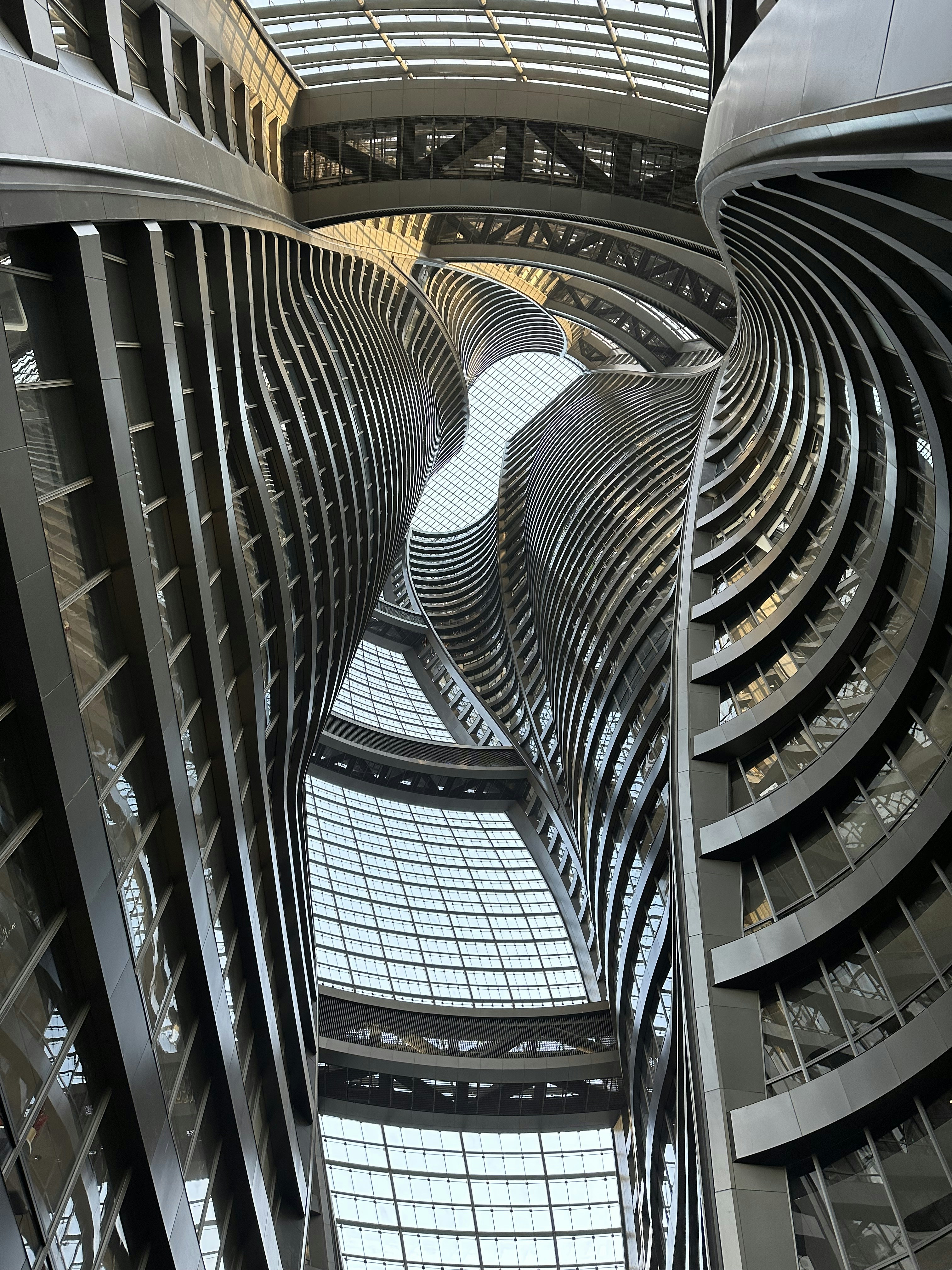 Between Helix and Glass: The Spiral Atrium of Steel and Sky
