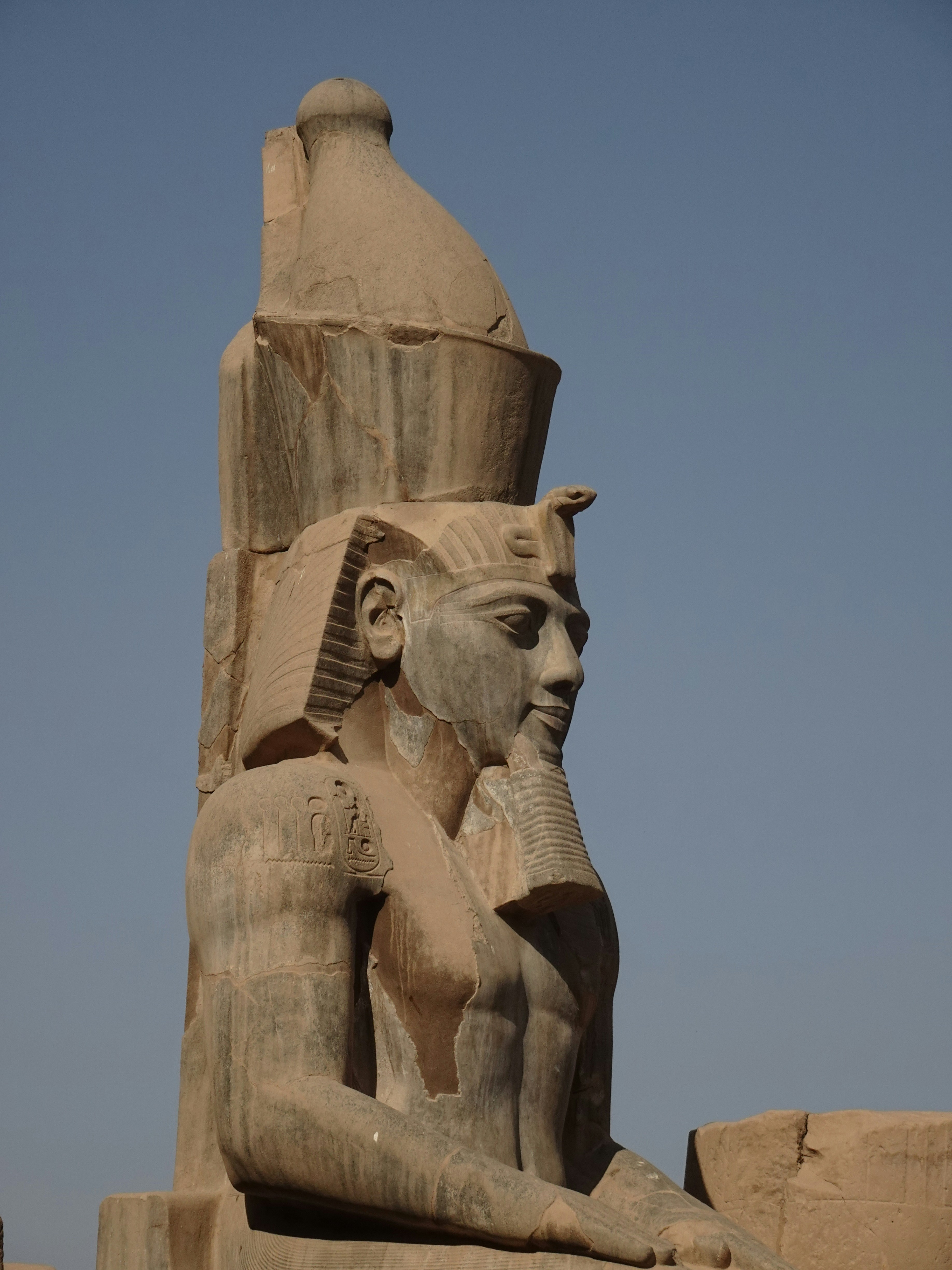 Sphinx-like Statue Reaching Toward the Calm Sky