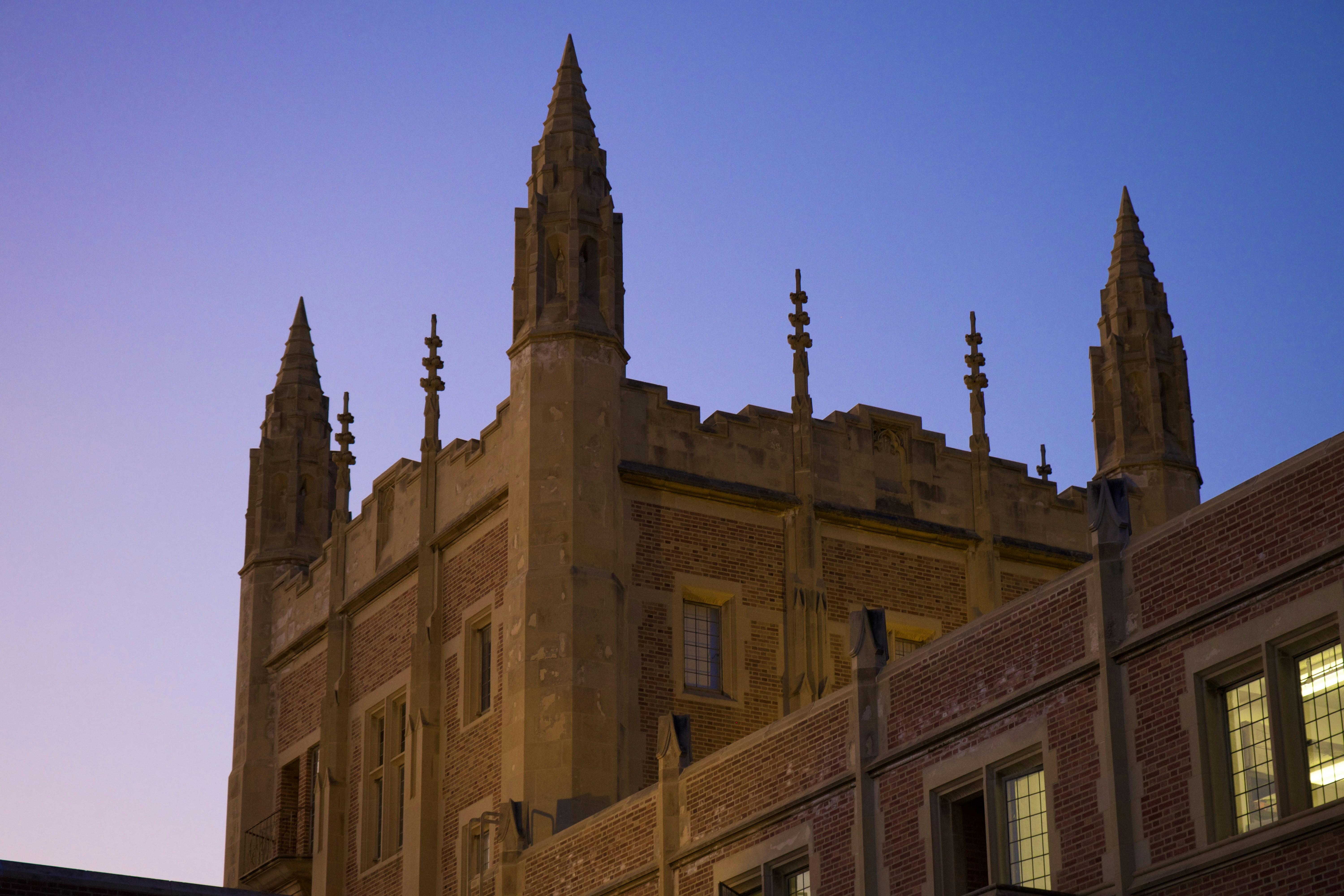 A tall building with a clock on the front of it photo – Free Ucla Image ...