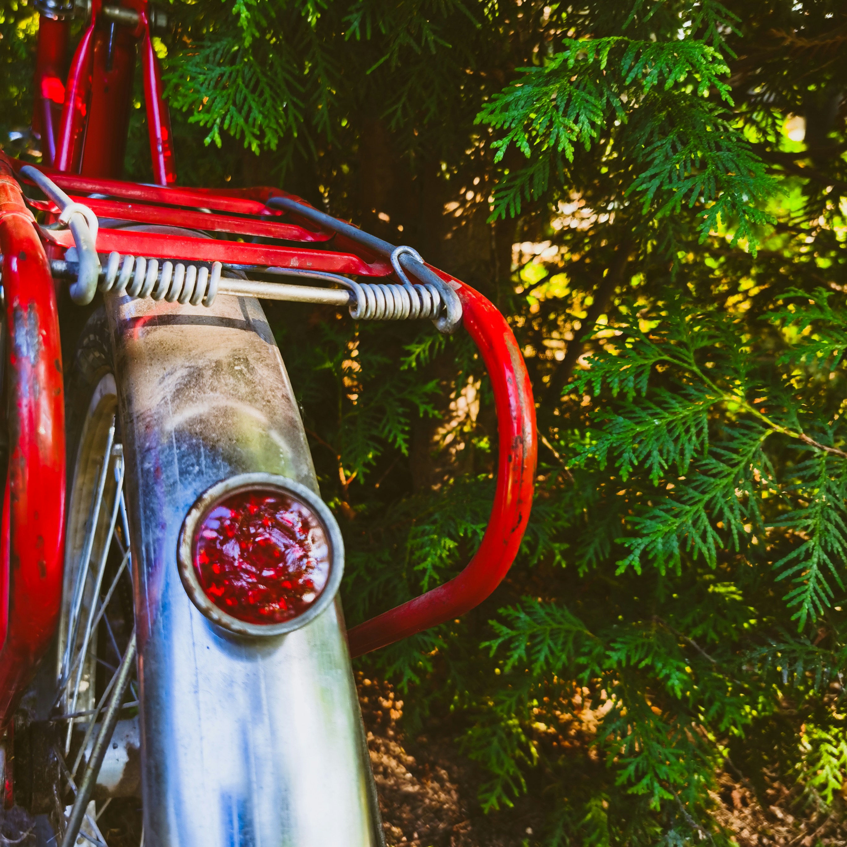 a close up of a bike with a red handlebar