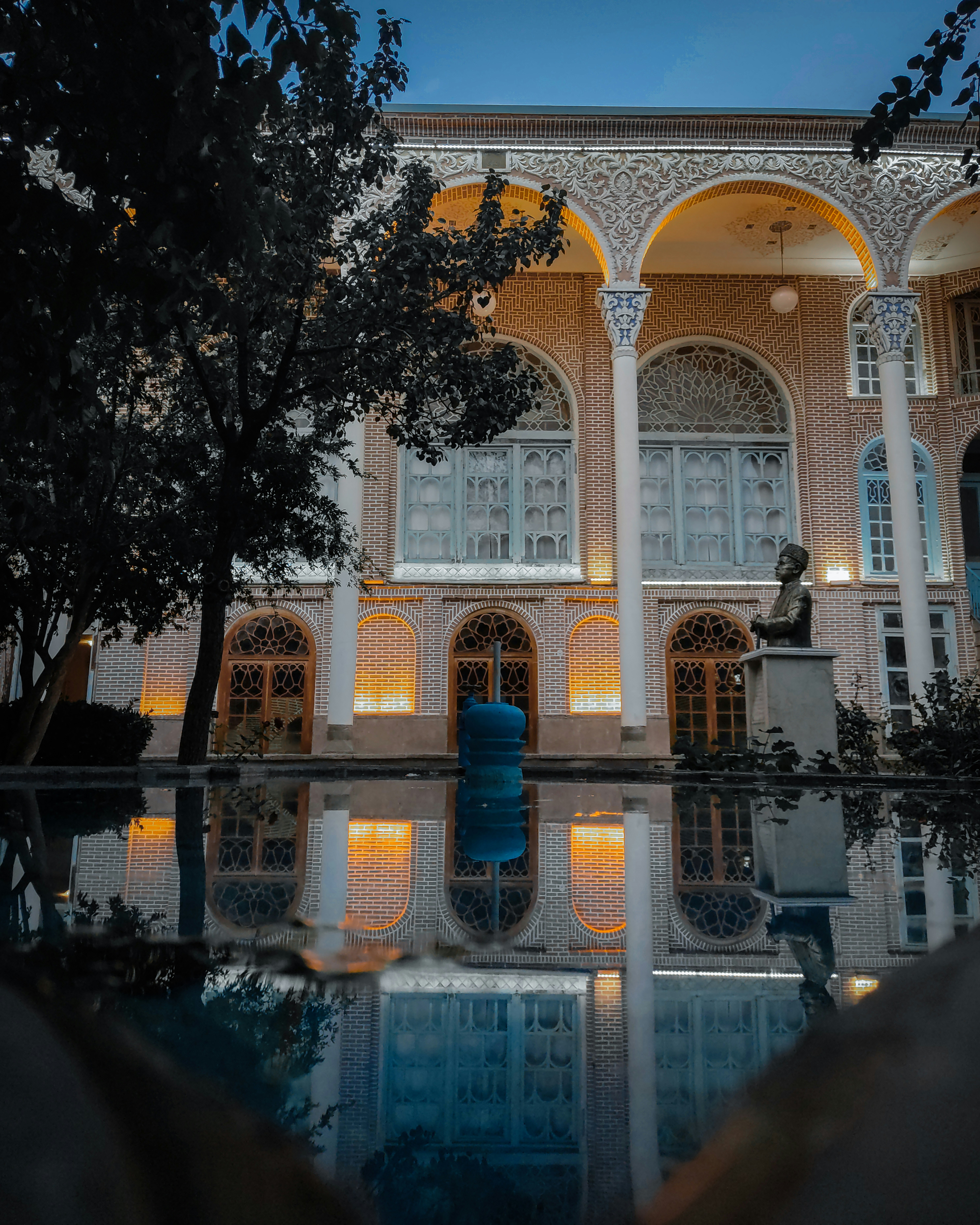 A large building with a pool in front of it photo – Free Tabriz Image ...