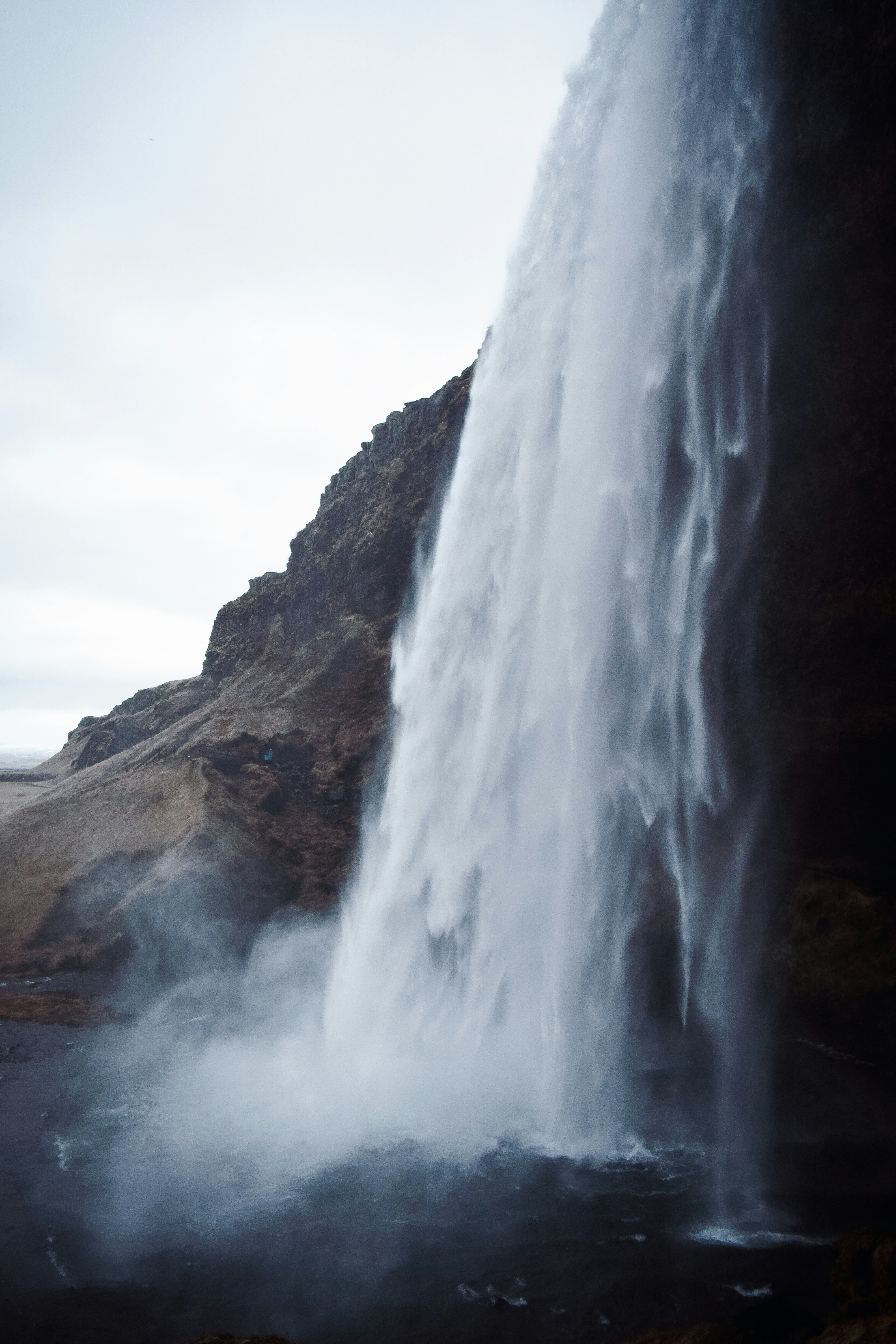 A very tall waterfall with water coming out of it photo – Free Iceland ...
