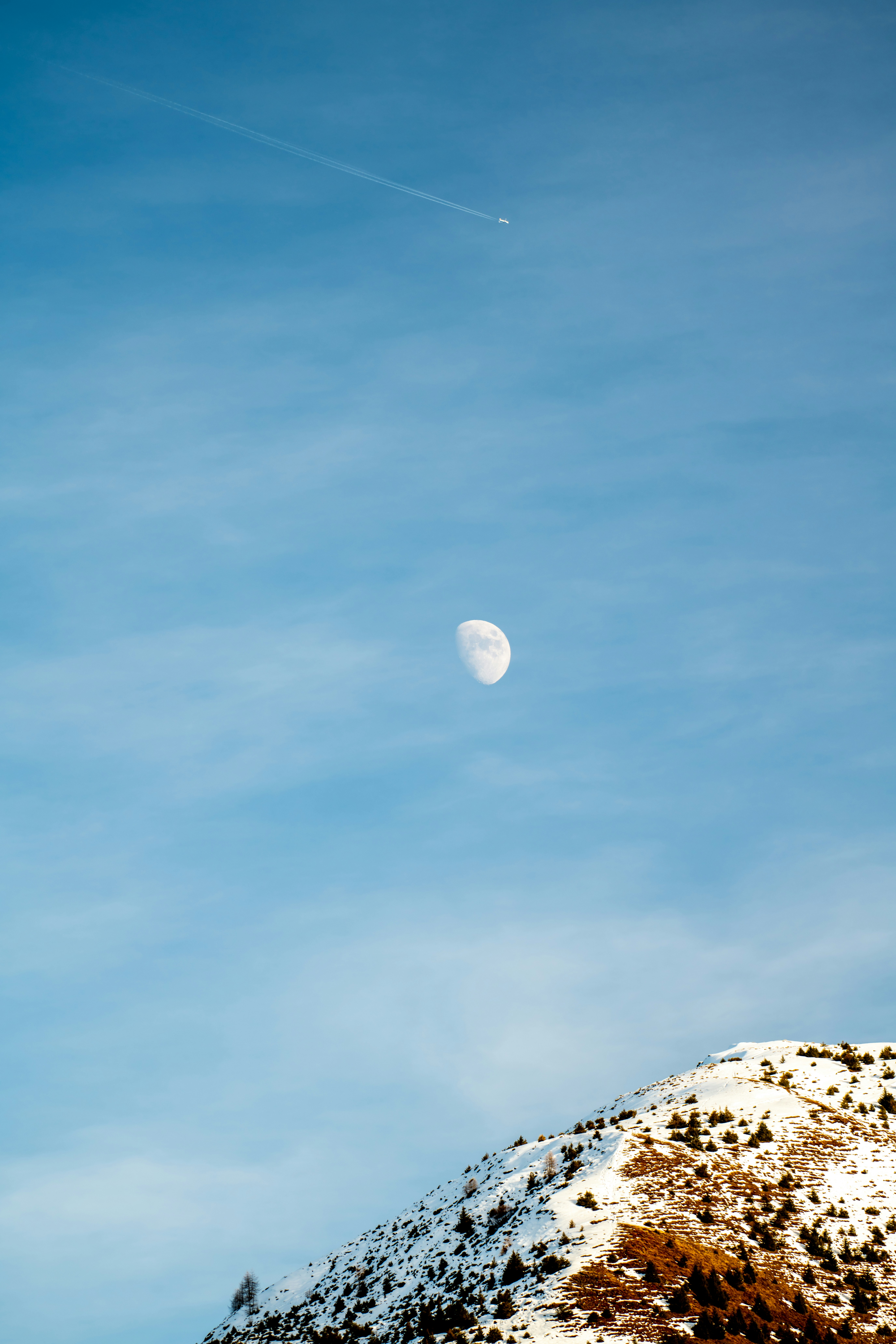 A view of the moon from the top of a mountain photo – Free Laax Image ...