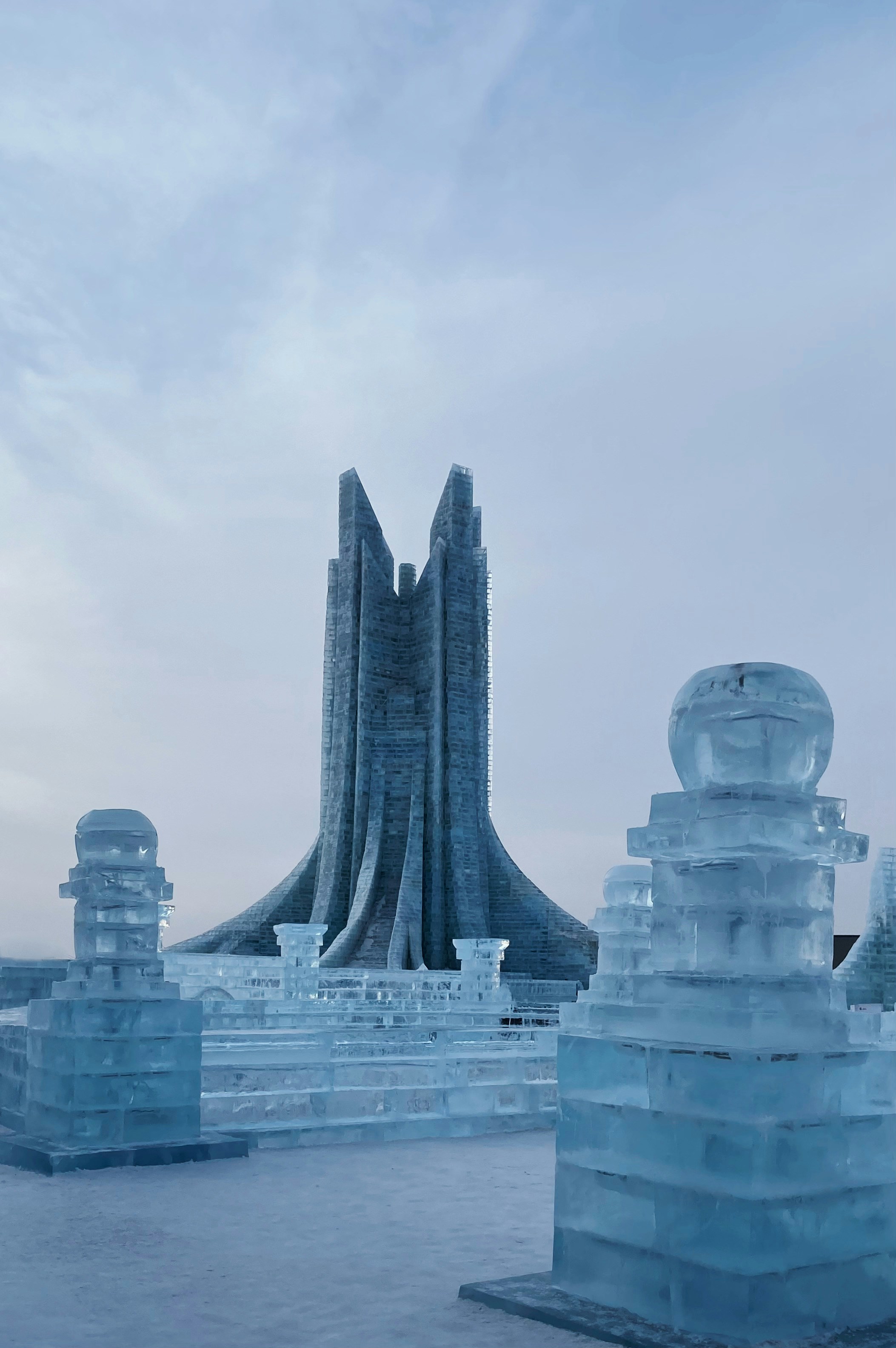 A large ice sculpture sitting on top of a frozen lake photo – Free ...