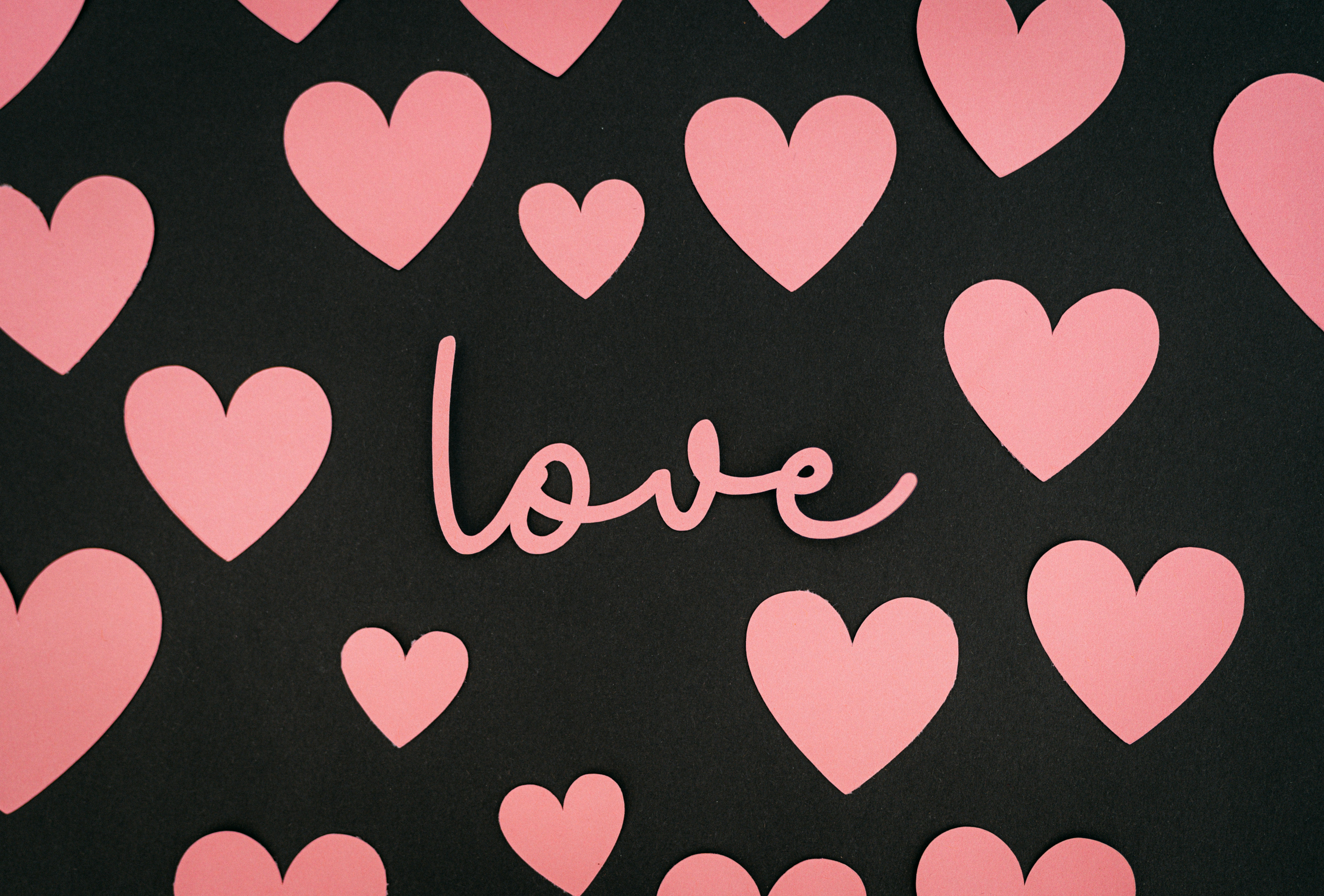 A black background with pink hearts and the word love photo – Free ...