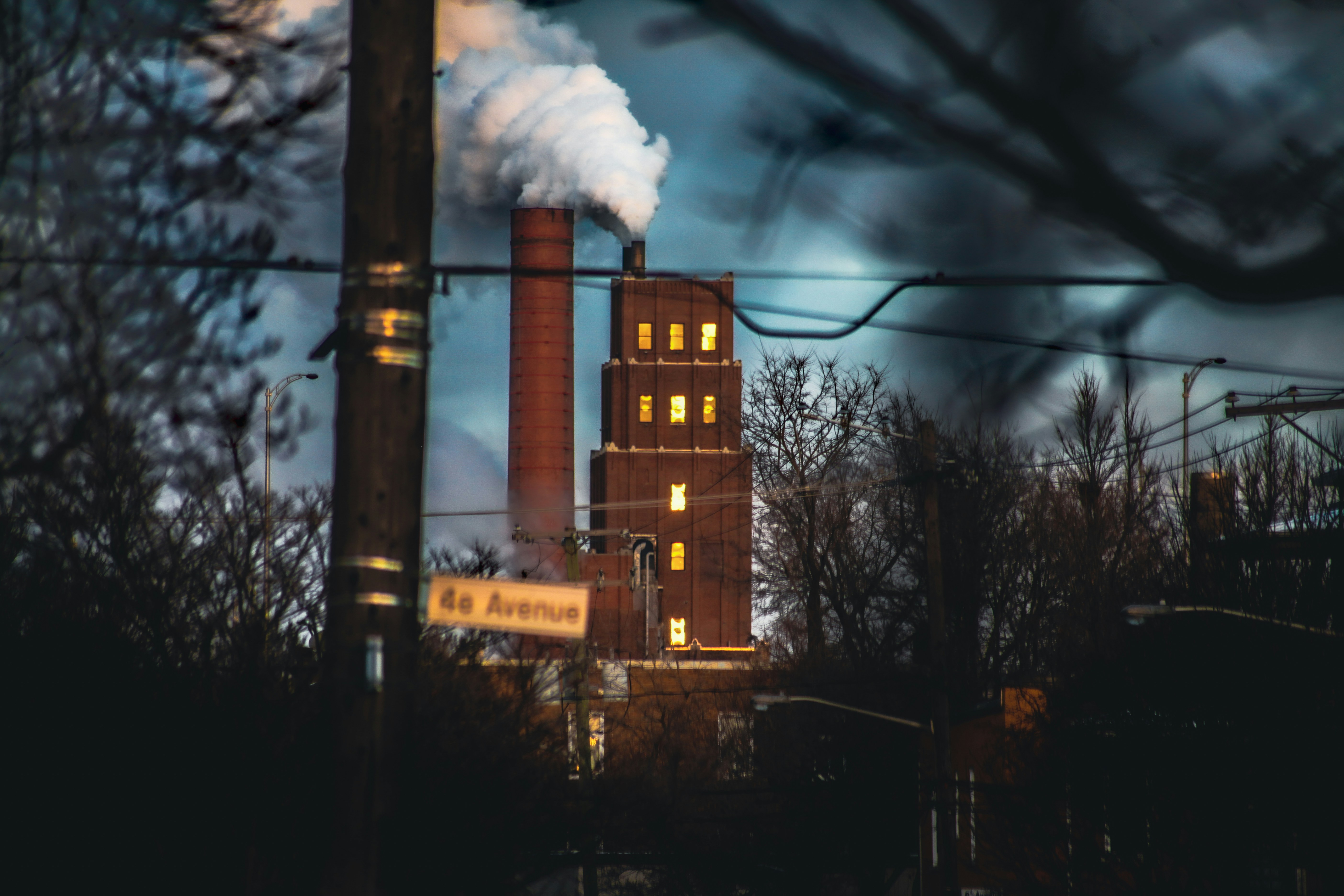 a factory with smoke coming out of it's stacks