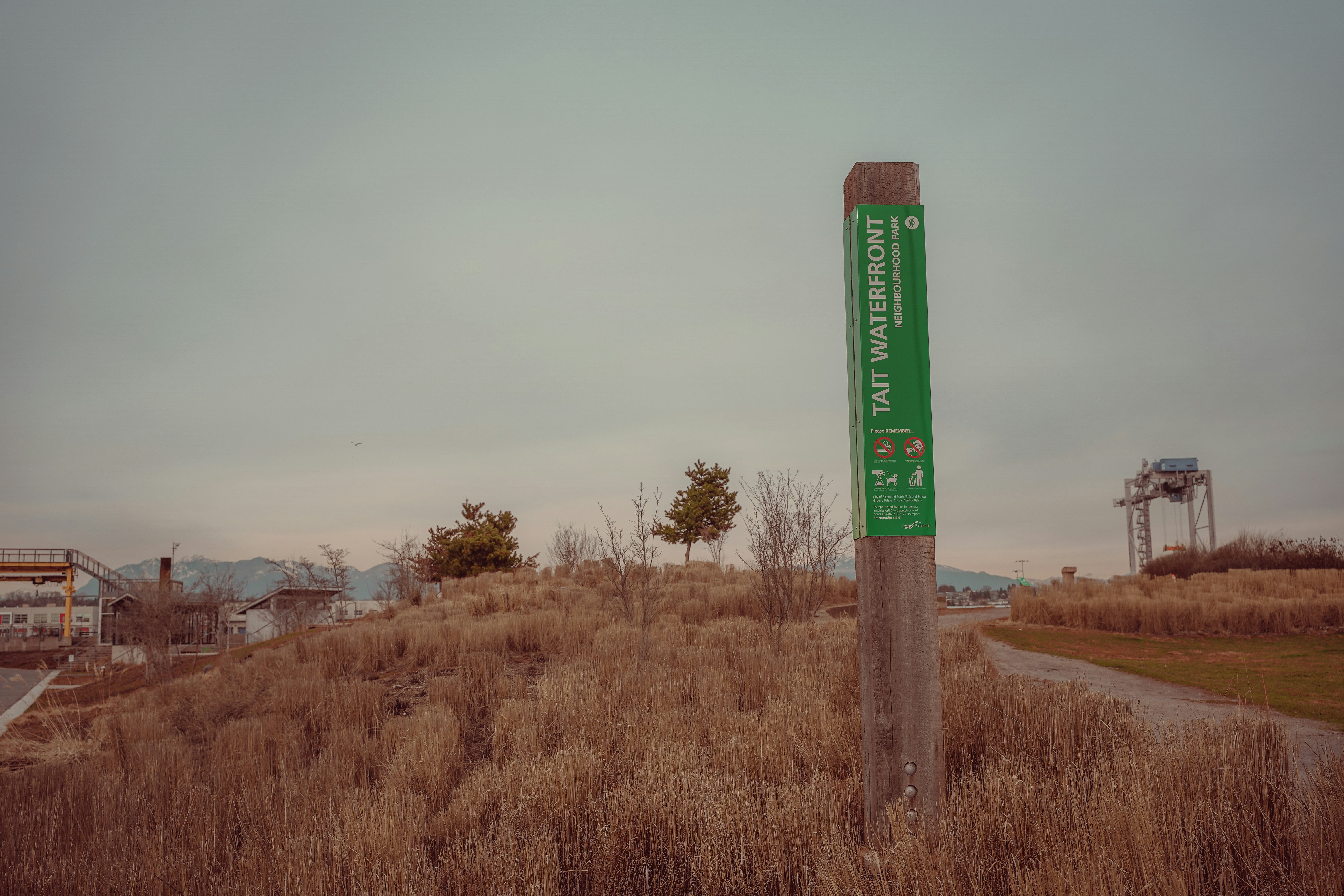 Green Waymarker Against Open Landscape